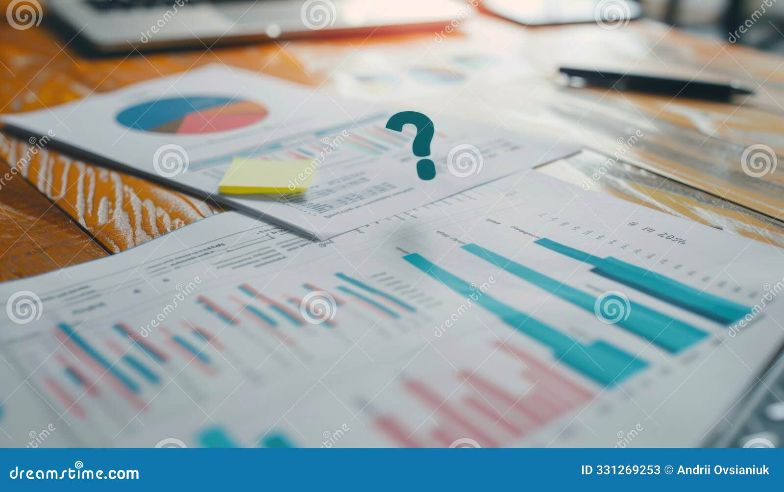 Analyzed Business Reports and Charts on a Workspace Table with Question ...