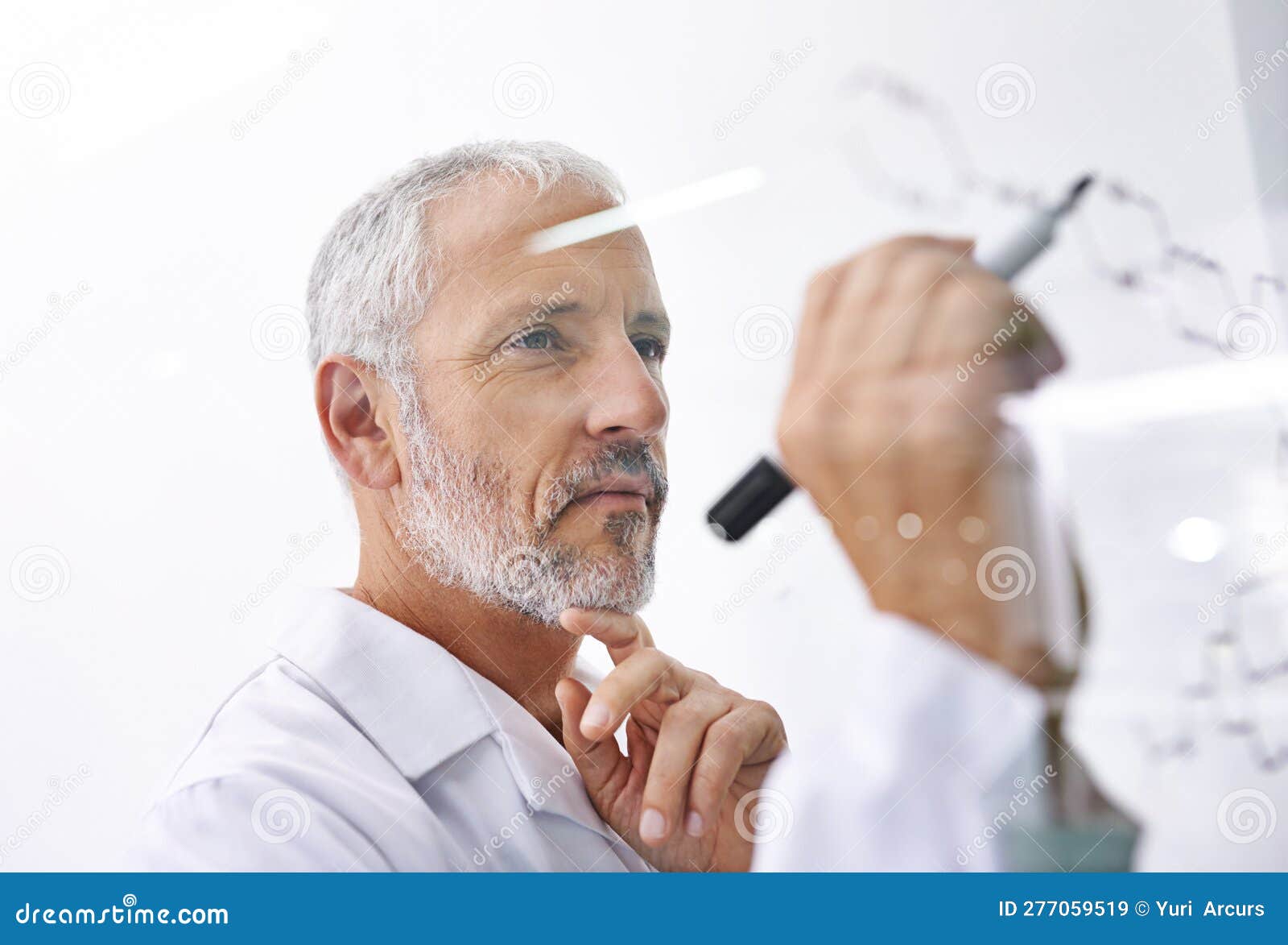 Analyzing the Chemical Bonds. a Mature Male Scientist Drawing a ...