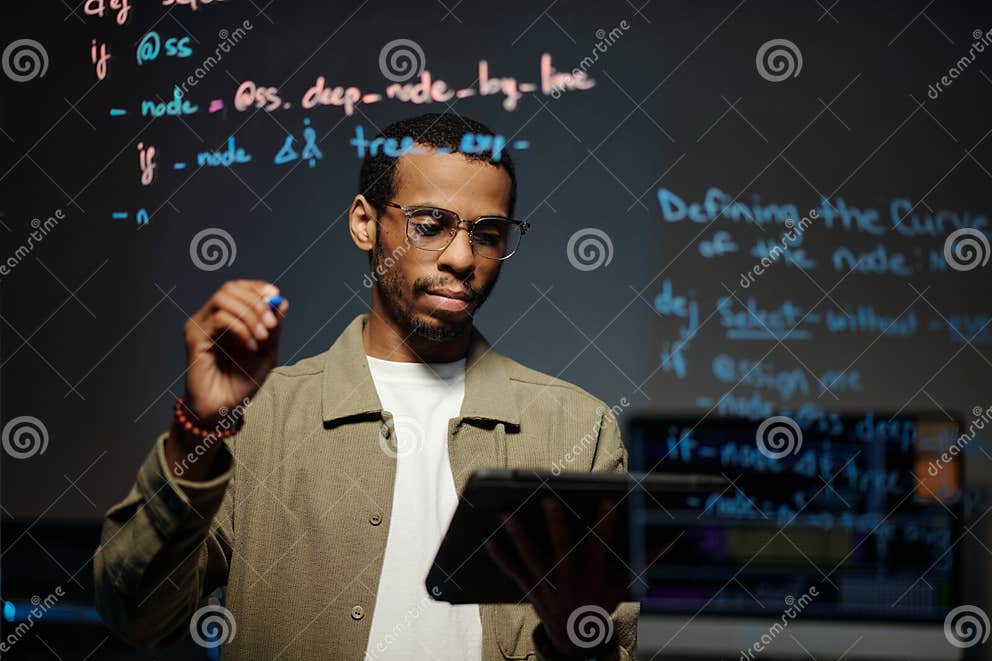Analyzing Code on Tablet for Software Development Stock Photo - Image ...