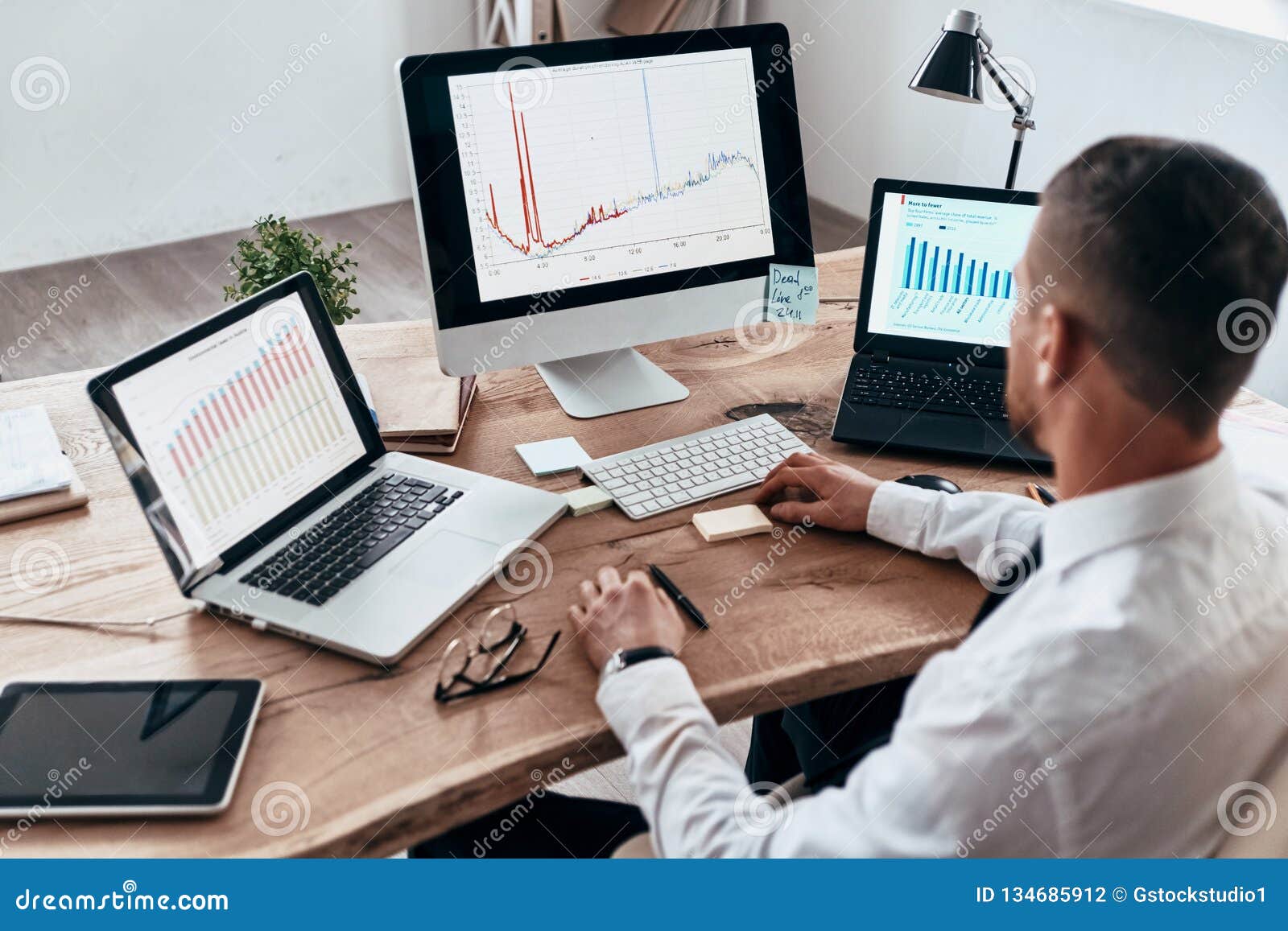 Analyzing sales pitch. stock photo. Image of males, adult - 134685912