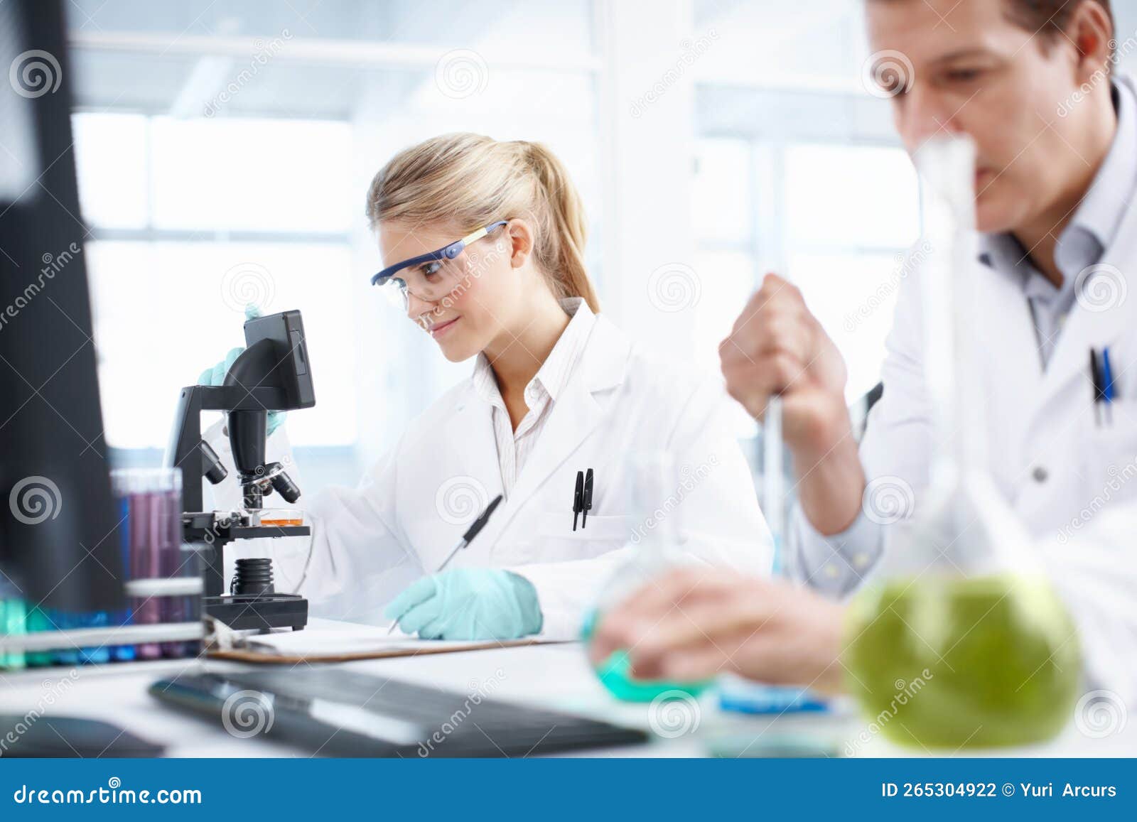 Analyzing Samples. Two Researchers Hard at Work in the Laboratory ...