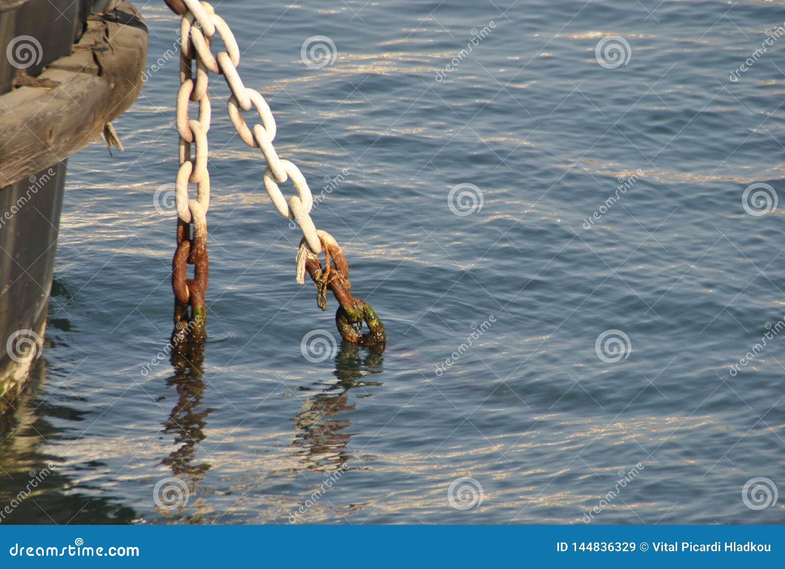 Anchor chain on the water stock image. Image of pier - 144836329