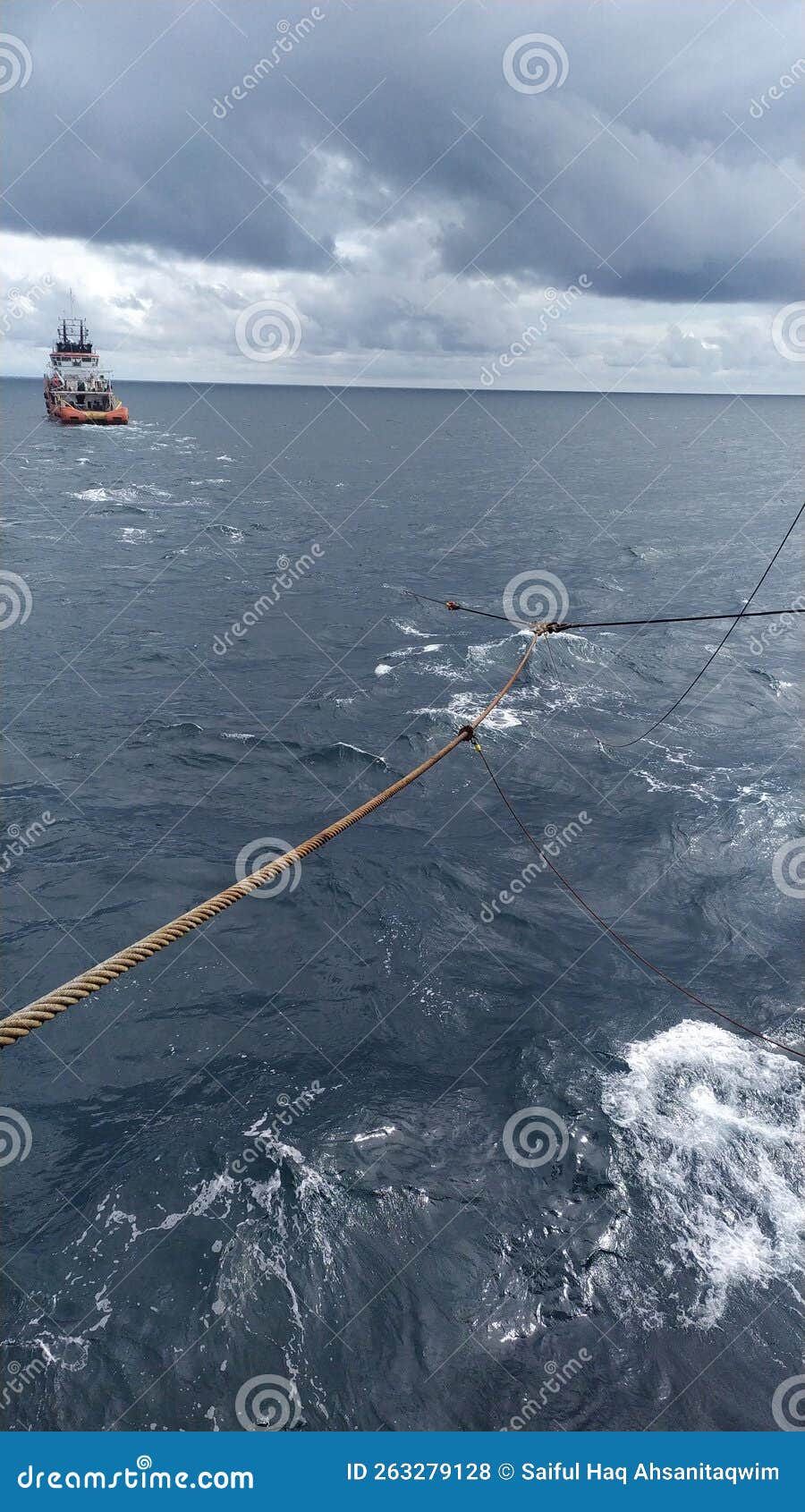 Anchor Handling Tug Towing a Barge Stock Photo - Image of wind ...