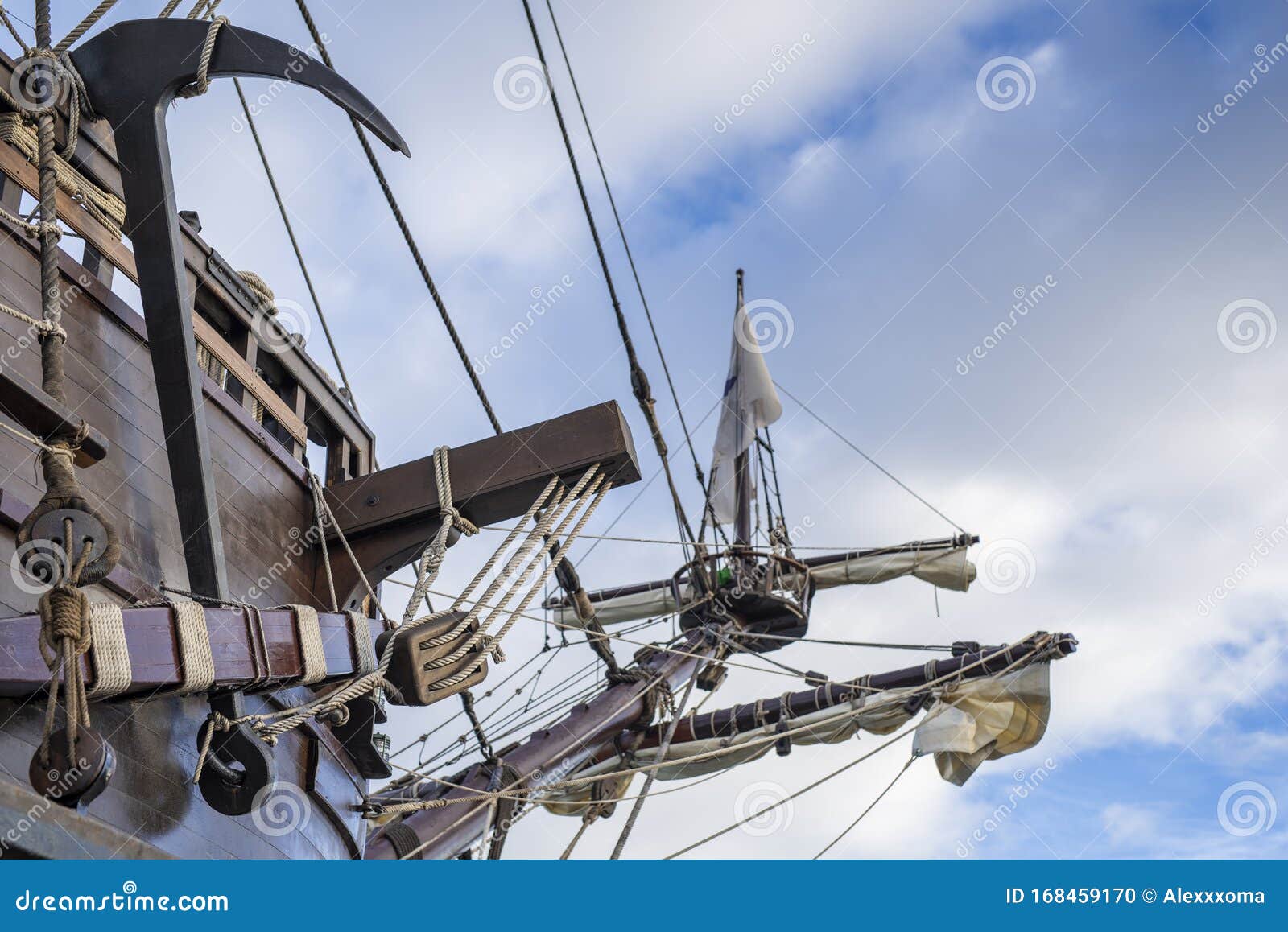 Anchor, Masts and Rigging of Old Pirate Ship on Background of Cloudy ...