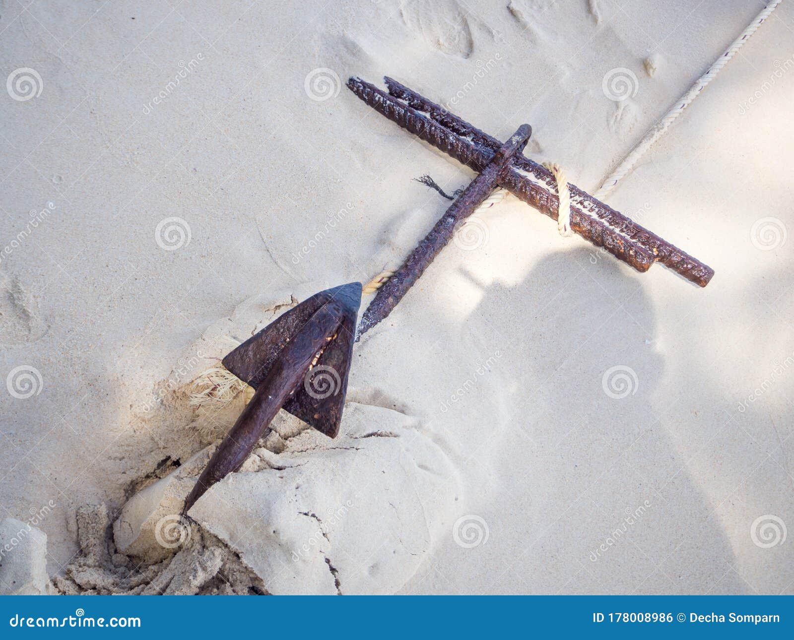 Anchor and White Rope on the Sand Stock Photo - Image of anchor, sandy ...