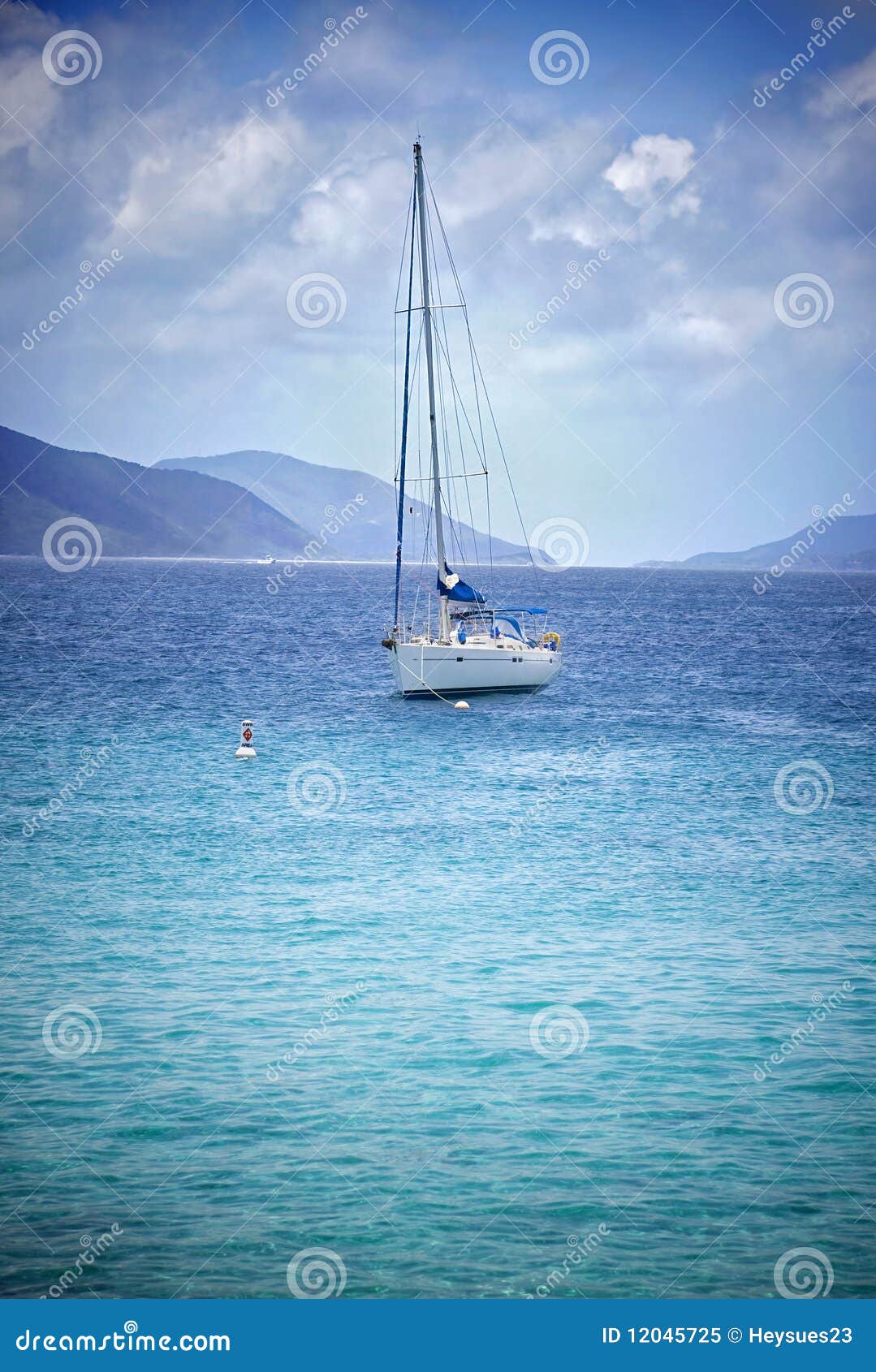 Anchored sailboat stock image. Image of clouds, caribbean - 12045725