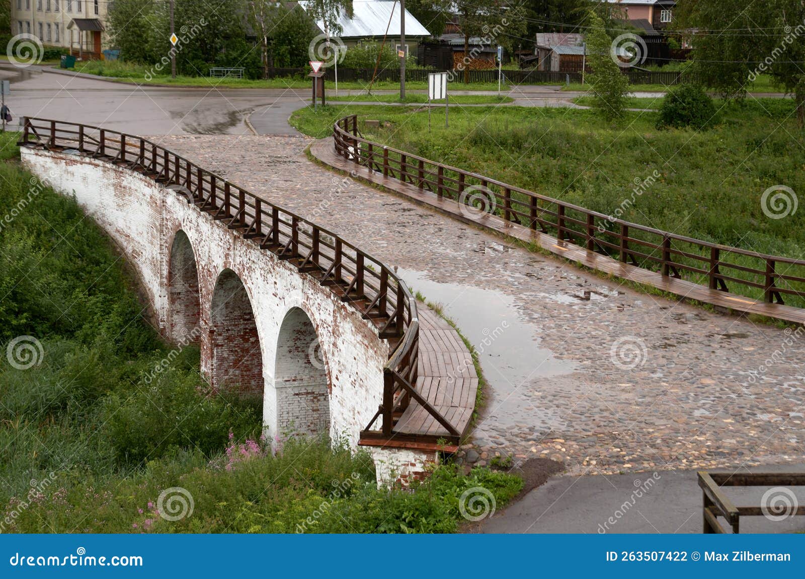 Ancient Arched Brick Bridge with Cobbled Pavement Stock Photo - Image ...