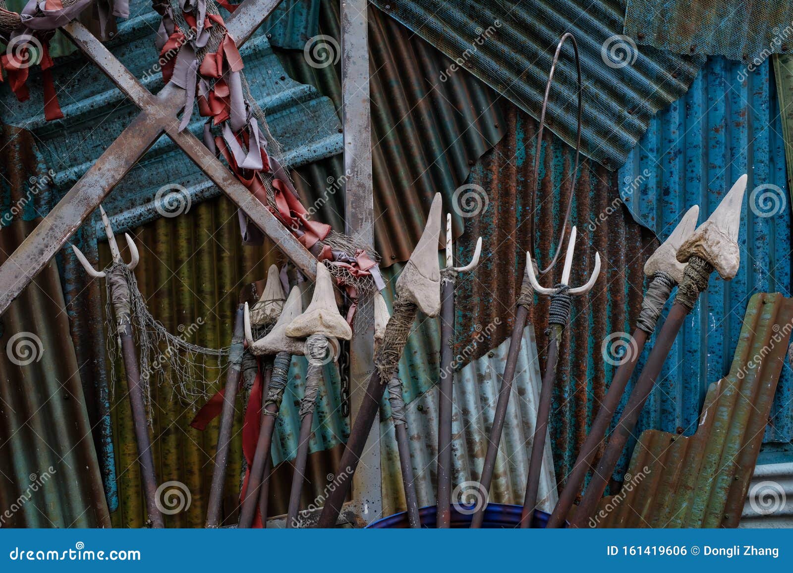 Ancient Bone Weapon Display in Front of Rusty Metal Wall Stock Photo ...