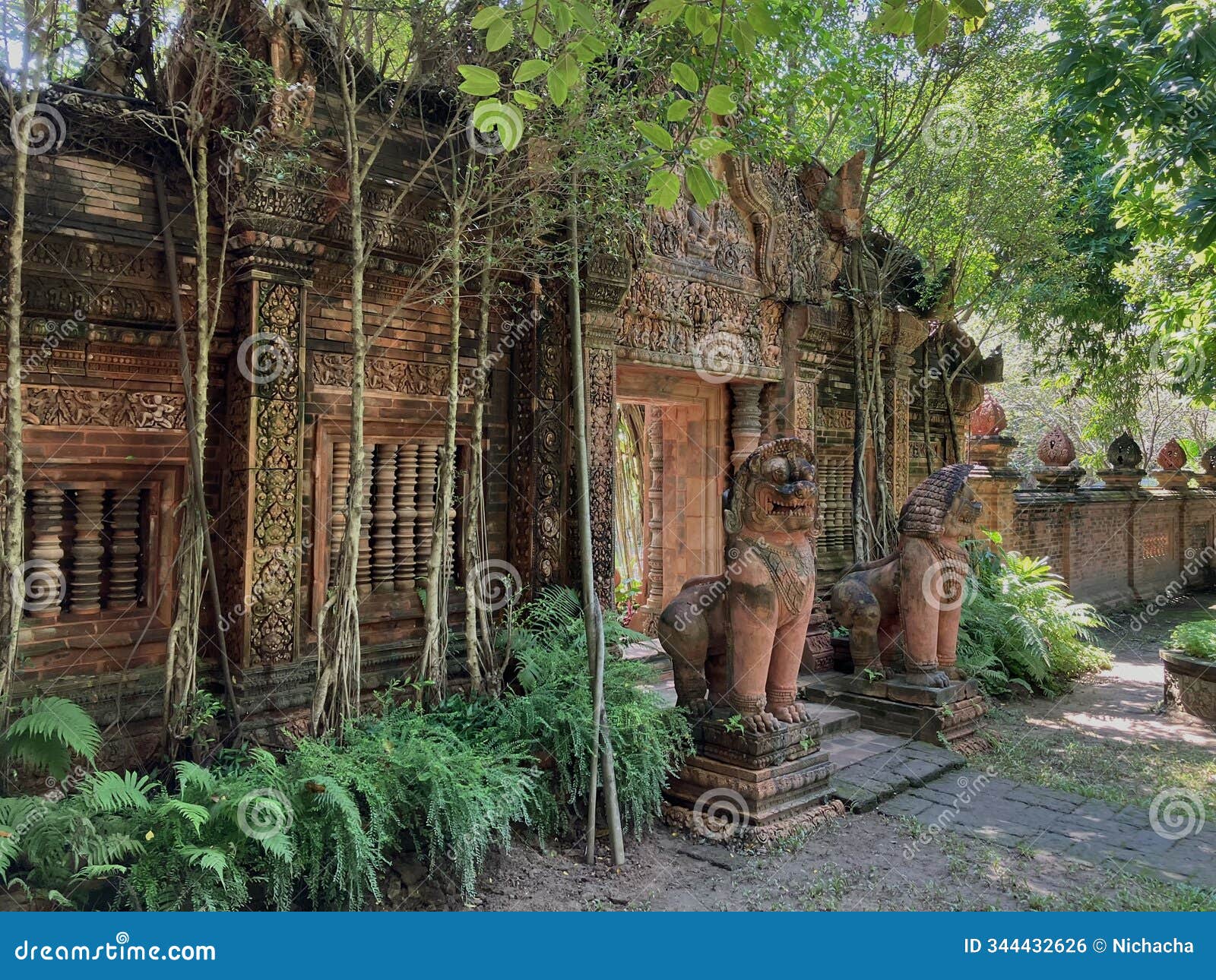 An Ancient Wall with Statues in Front and Decorated with Trees. Stock ...