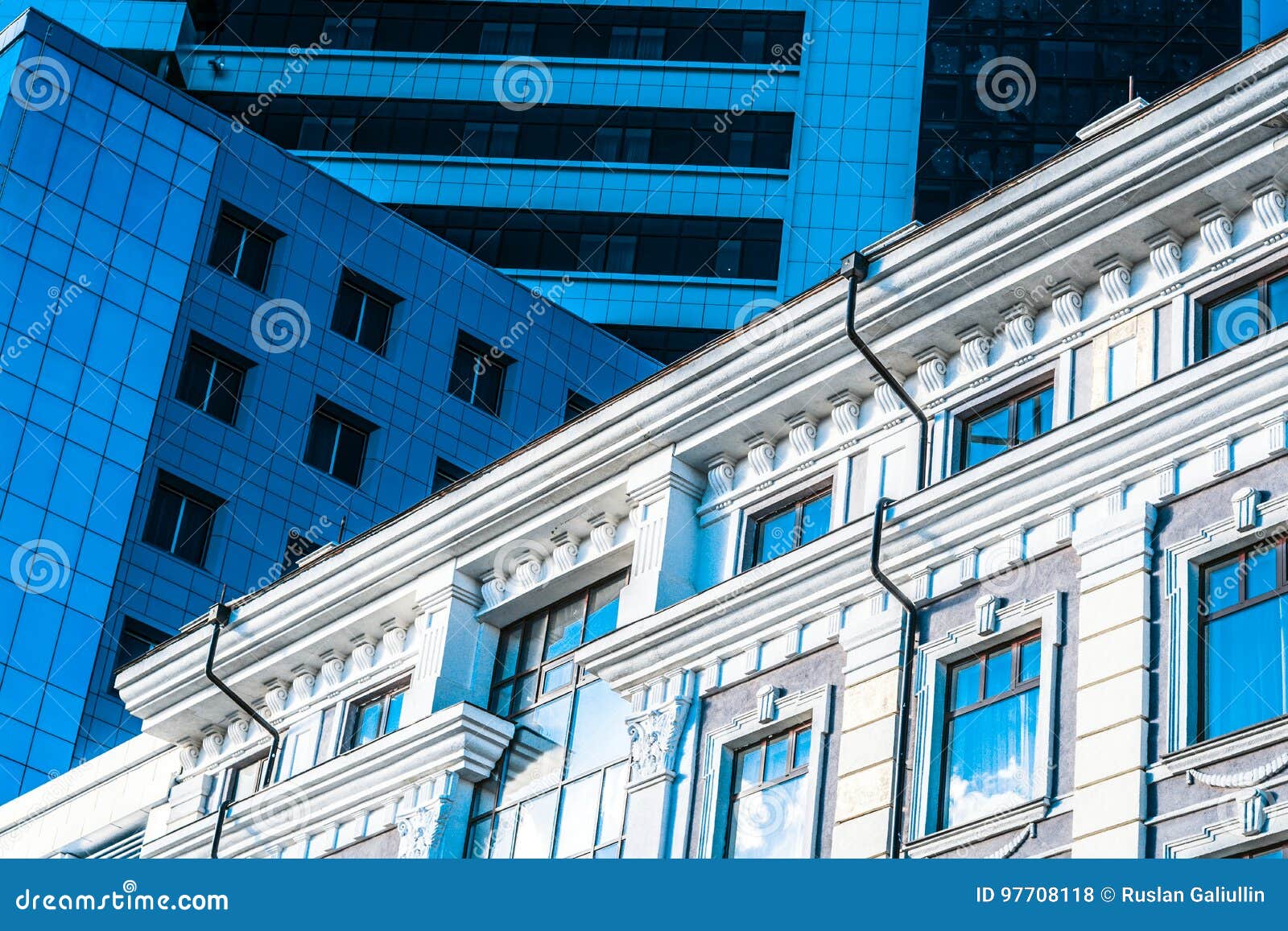 An Ancient Building Next To a Modern Office Building. Abstract Image of ...