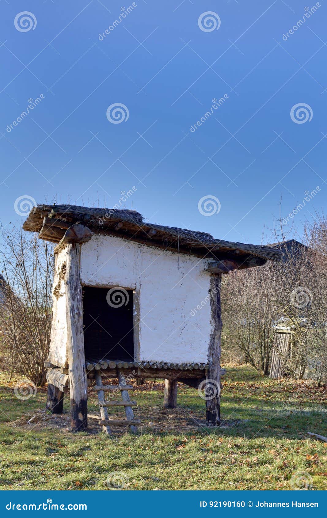 Ancient Celtic Building on Pillars with a Blue Sky Stock Photo - Image ...