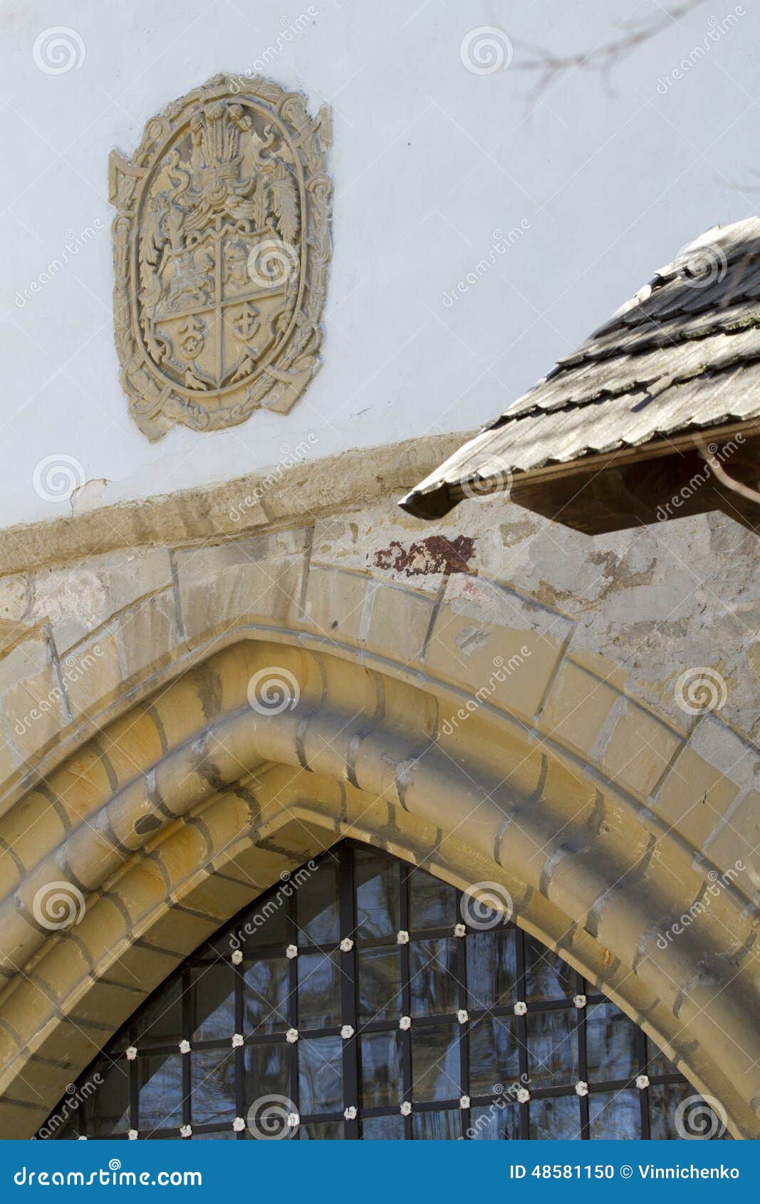 The Ancient Coat of Arms Over the Gate of the Castle. Stock Photo ...