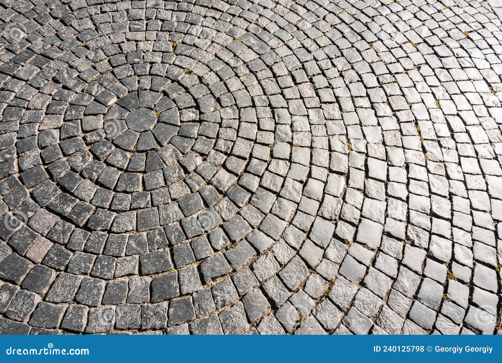 Ancient Cobblestone Paved Circle on the Pavement Stock Photo - Image of ...