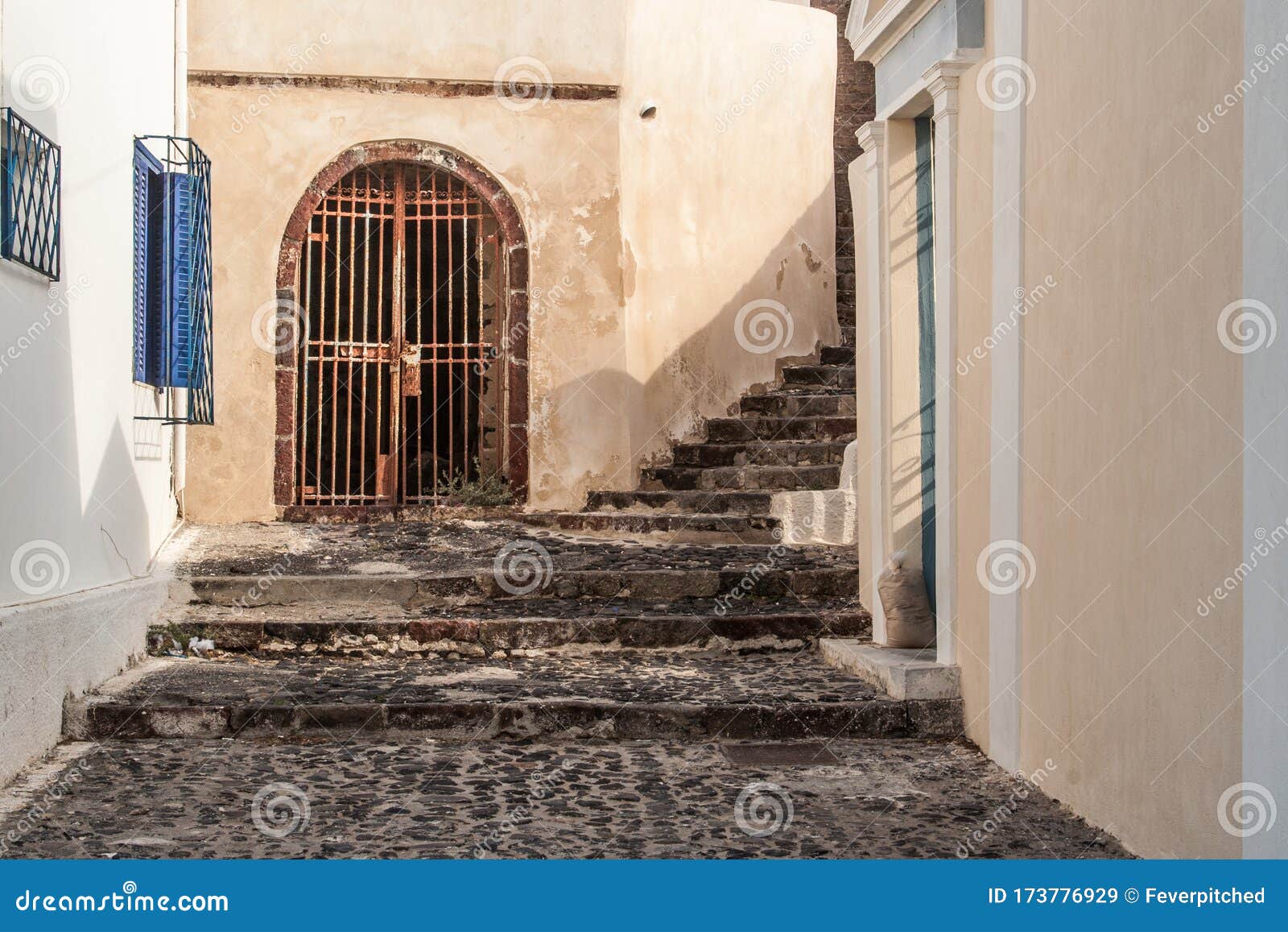Ancient Cobblestone Walkway and Steps among Building in Santorini ...