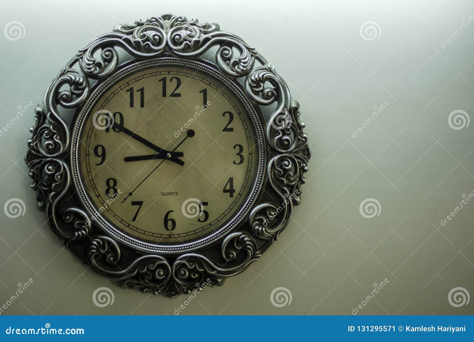 Ancient Designer Wall Clock with Light Yellow Back Ground Showing Time ...