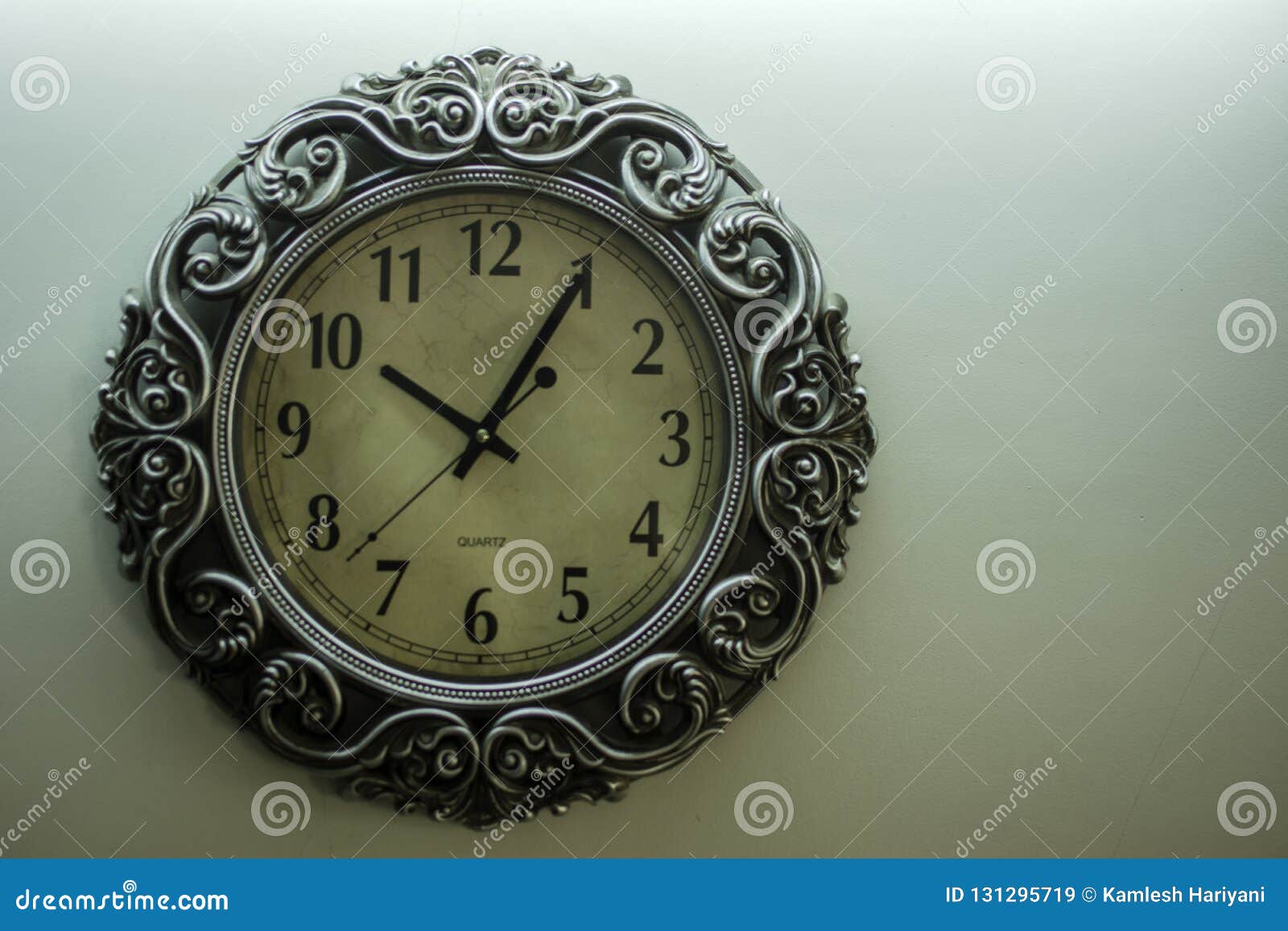 Ancient Designer Wall Clock with Light Yellow Back Ground Showing Time ...