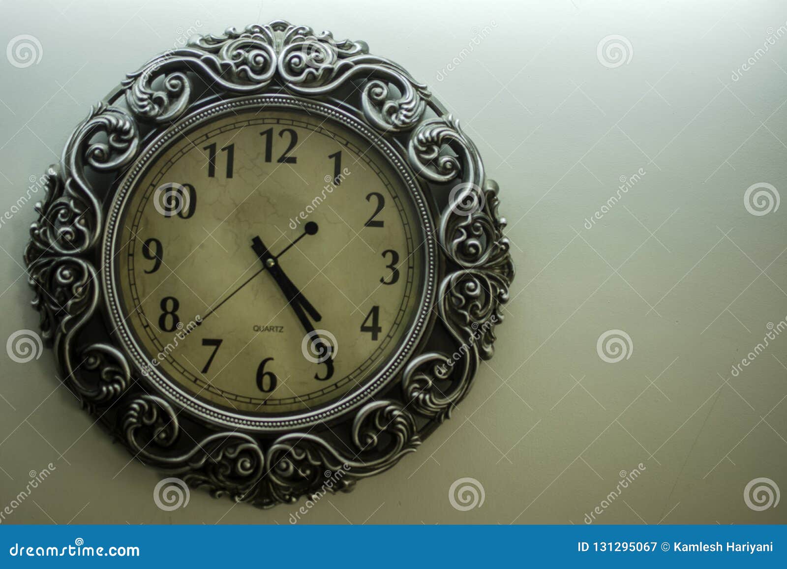 Ancient Designer Wall Clock with Light Yellow Back Ground Showing Time ...