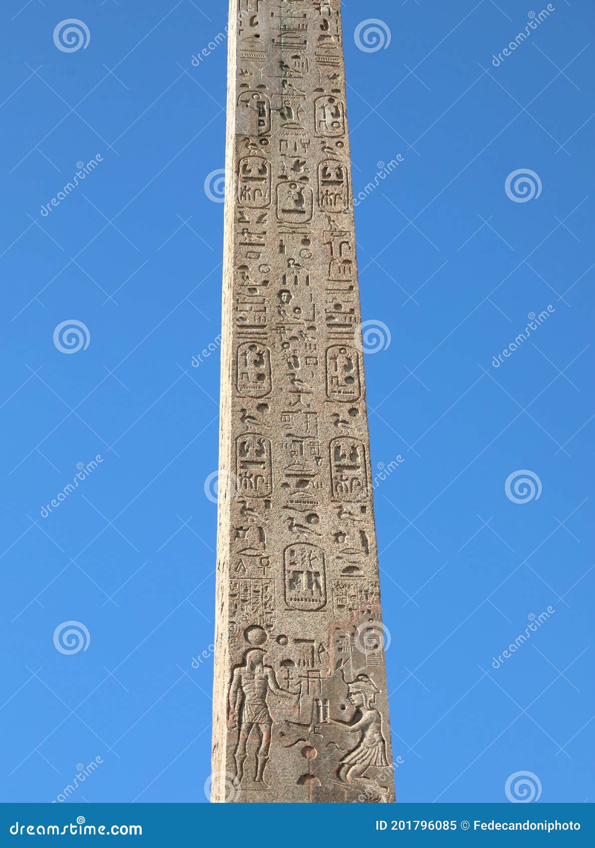 Ancient Egyptian Obelisk with Many Engraved Hieroglyphs and Sky Stock ...