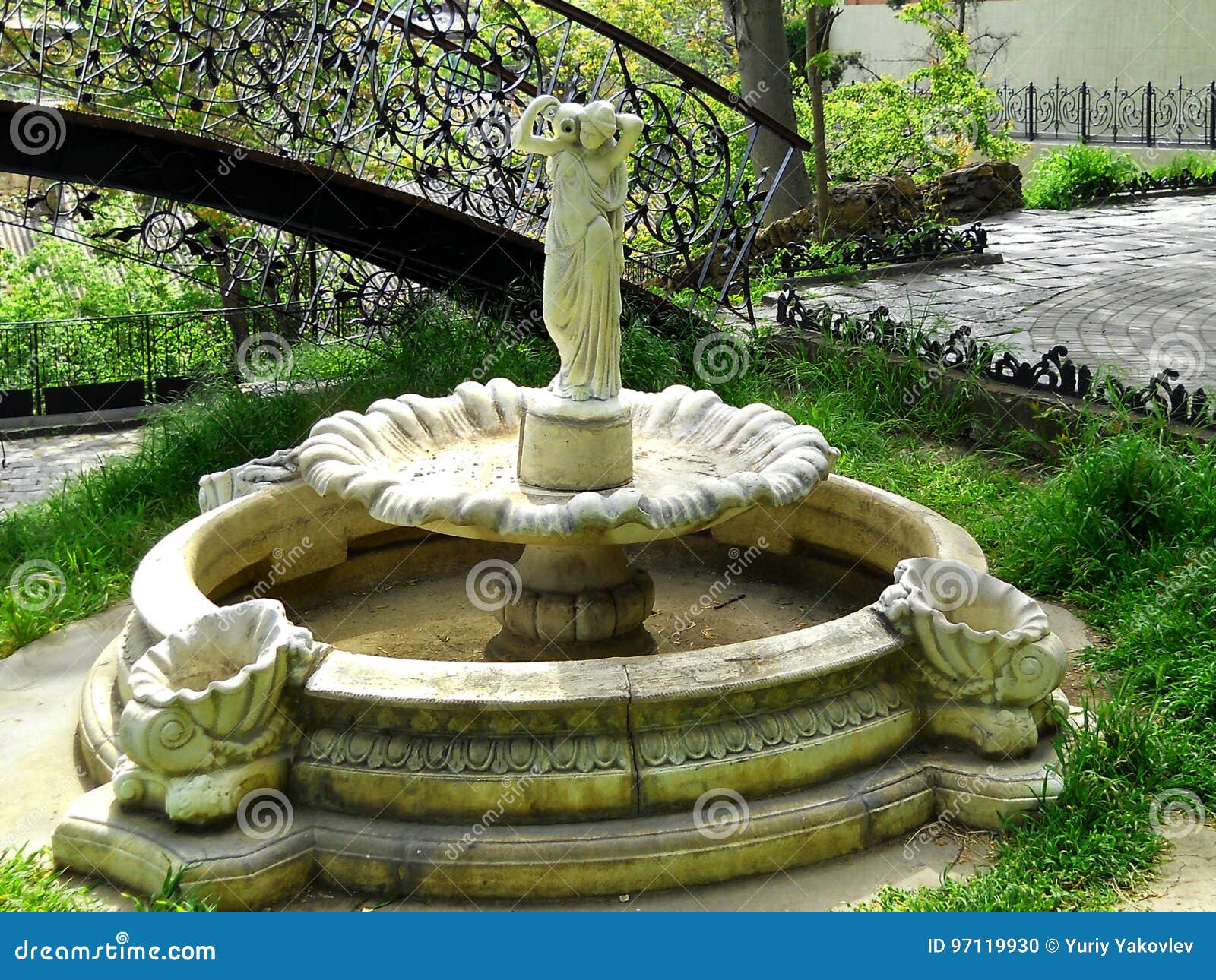 An Ancient Fountain with a Statue of a Woman . Stock Photo - Image of ...