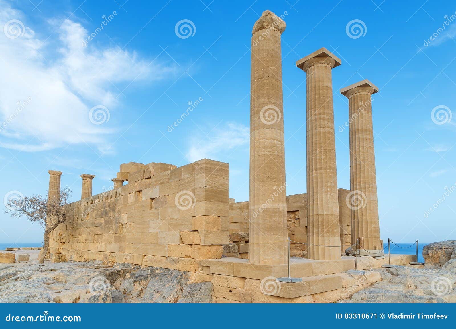 Ancient Greek Acropolis. Front View of Columns and Walls. Near the Tree ...