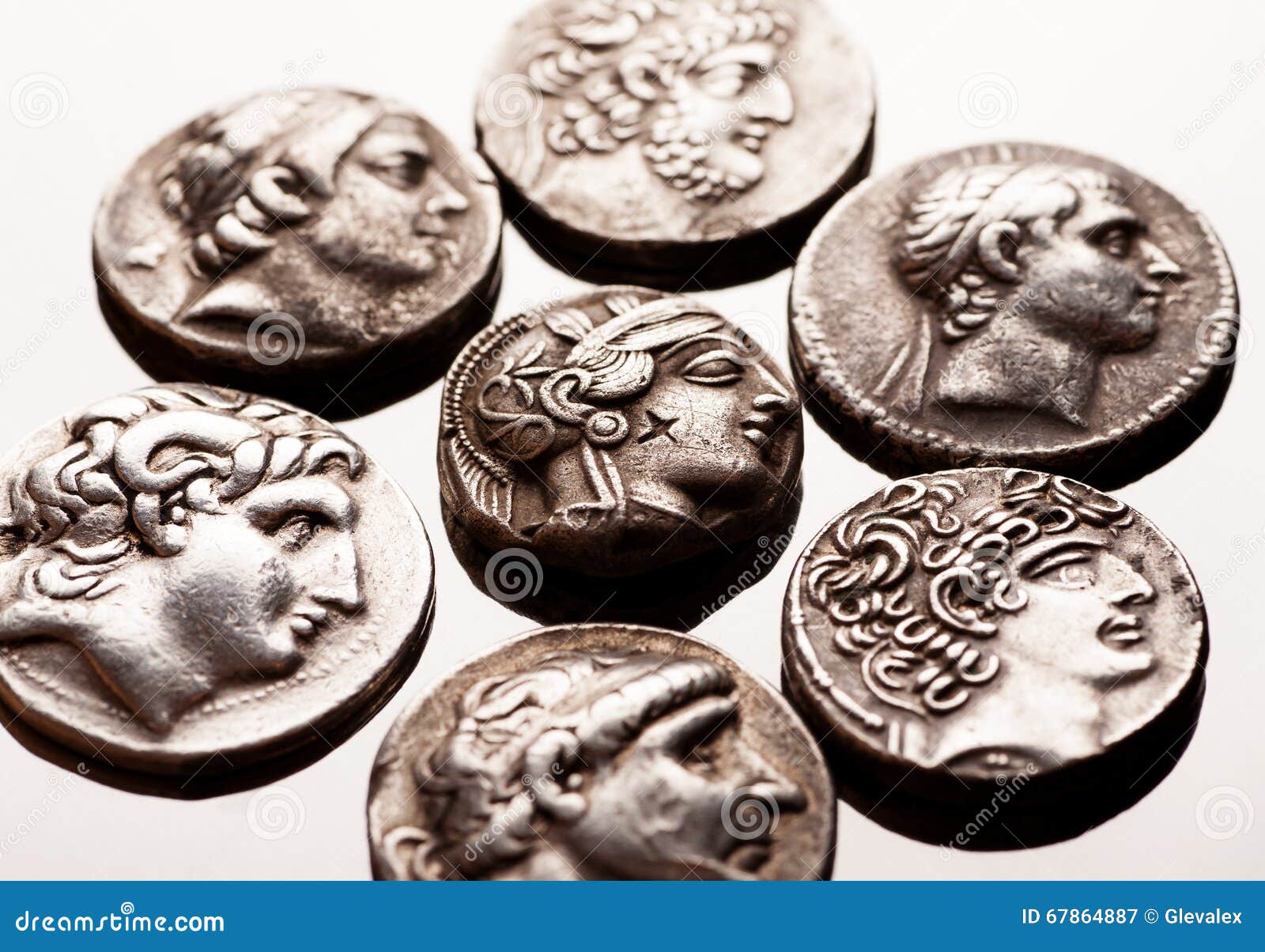 Ancient Greek Silver Coins on Reflective Surface Stock Image - Image of ...