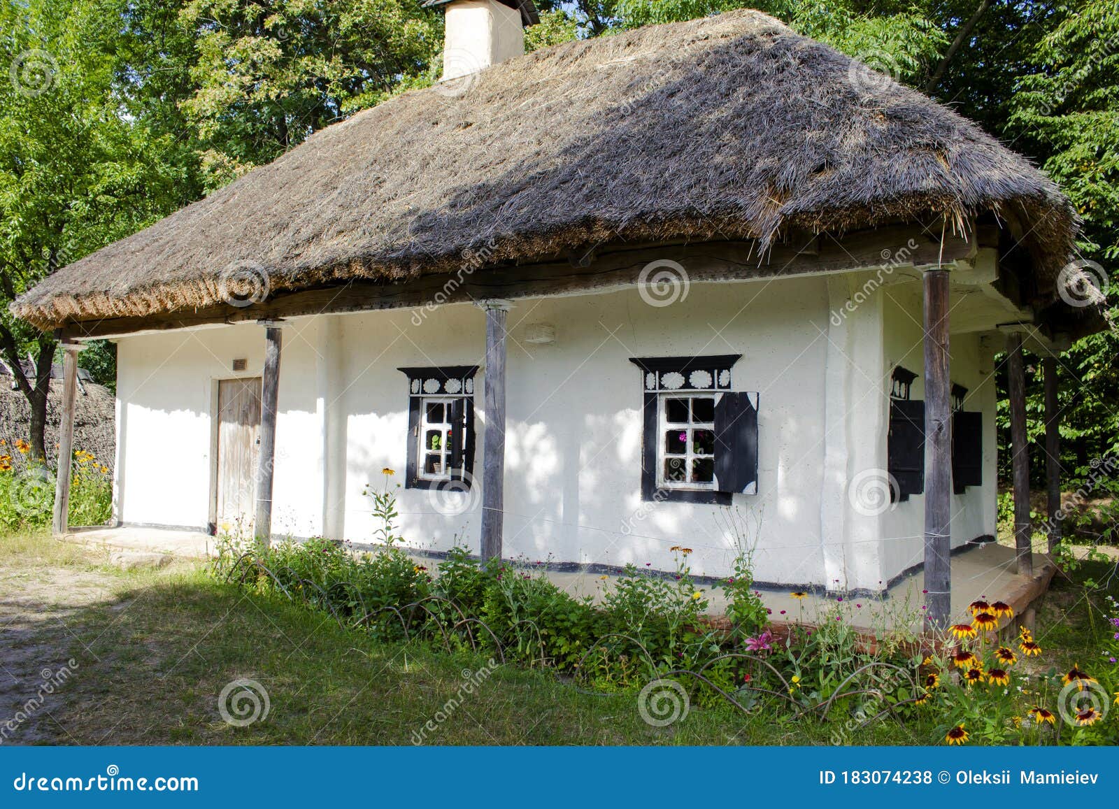 An Ancient House With Clay Whitewashed Walls, Thatched Roof And Rounded ...