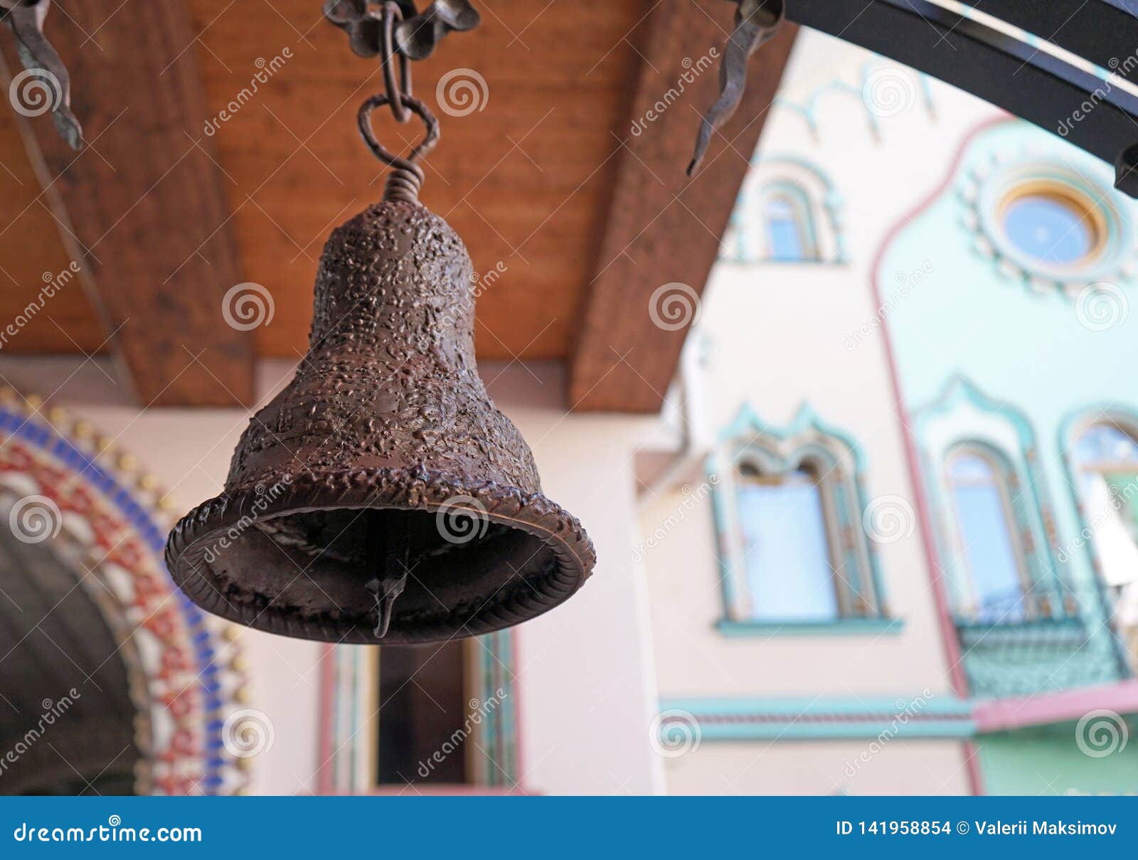 Ancient Iron Bell on the Background of a Wooden Structure Stock Photo ...