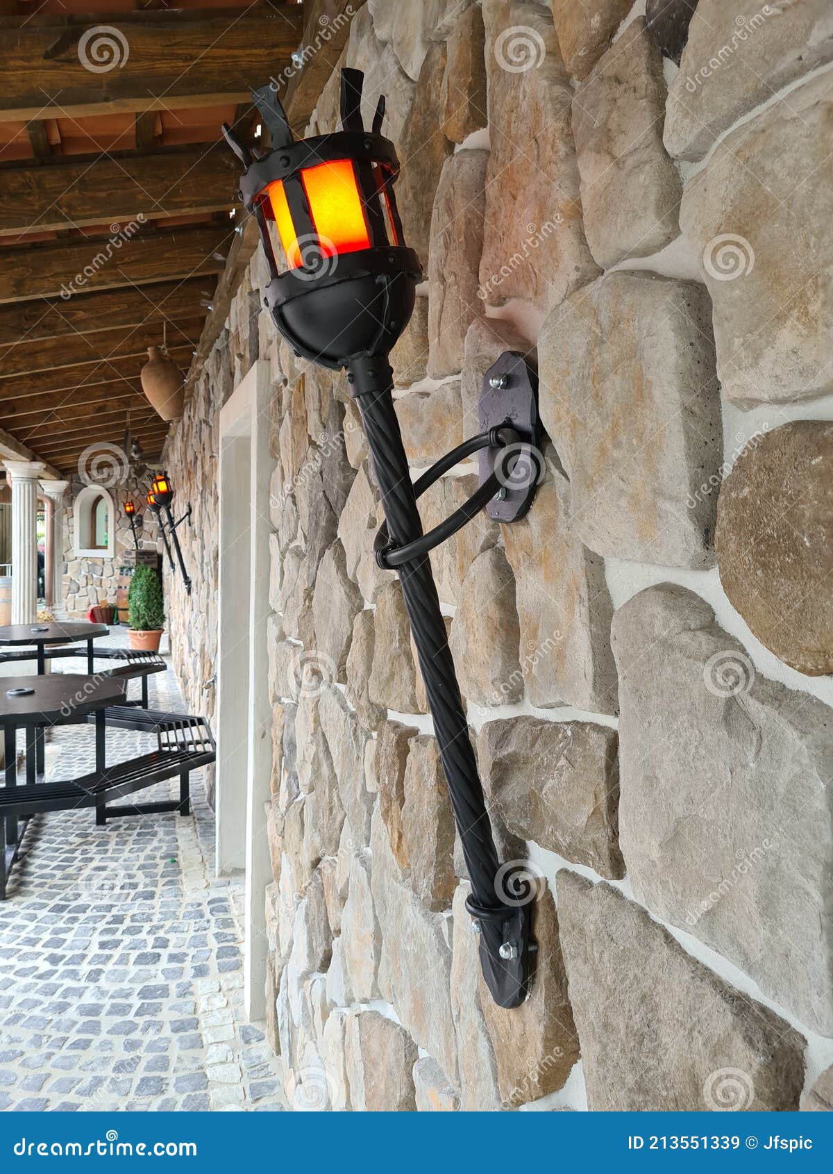 Ancient Iron Torch on Concrete White Wall Outside Stock Image - Image ...
