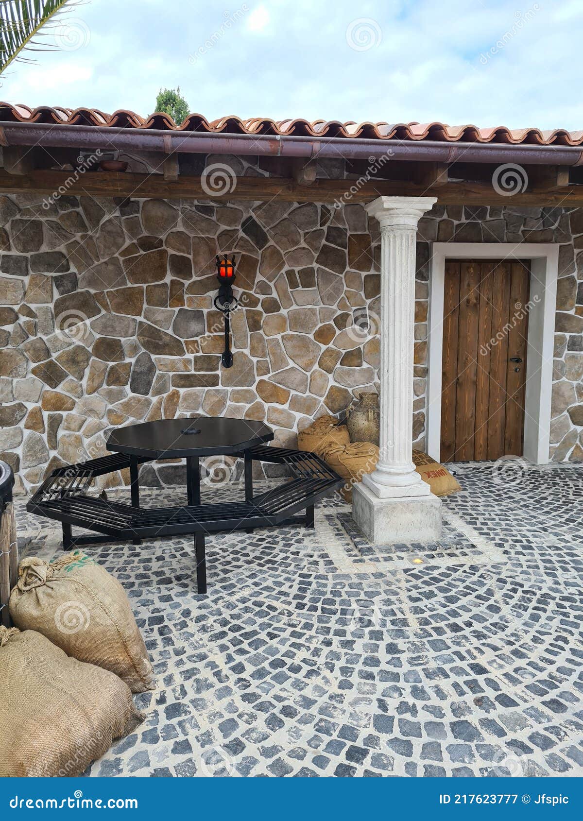 Ancient Iron Torch on Concrete White Wall Outside Stock Image - Image ...