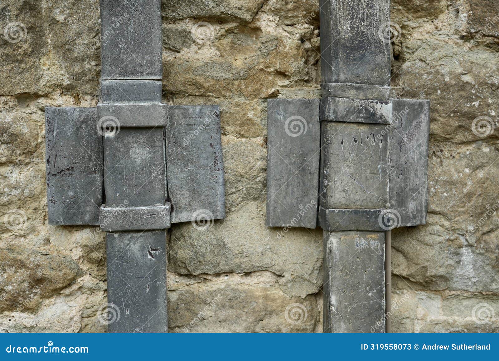 Ancient Lead Downpipes on a Stone Wall, England, UK. Stock Image ...
