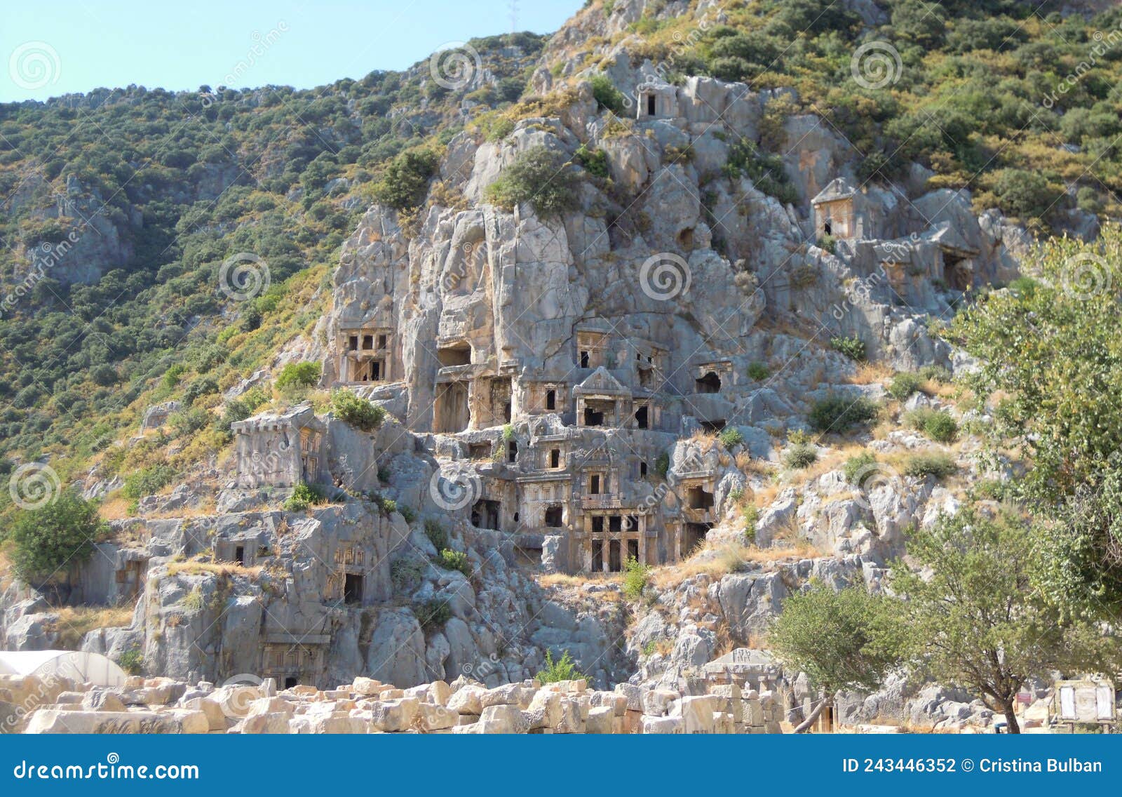 Ancient rocks with caves stock photo. Image of formation - 243446352