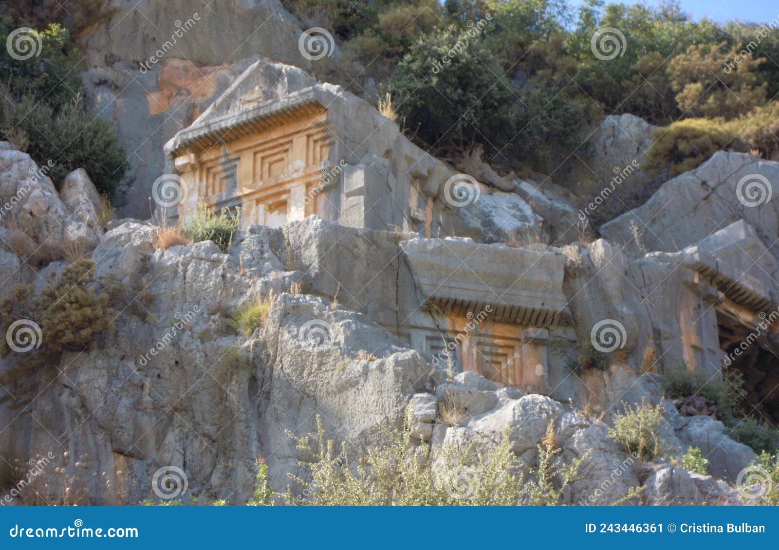 Ancient rocks with caves stock image. Image of terrain - 243446361