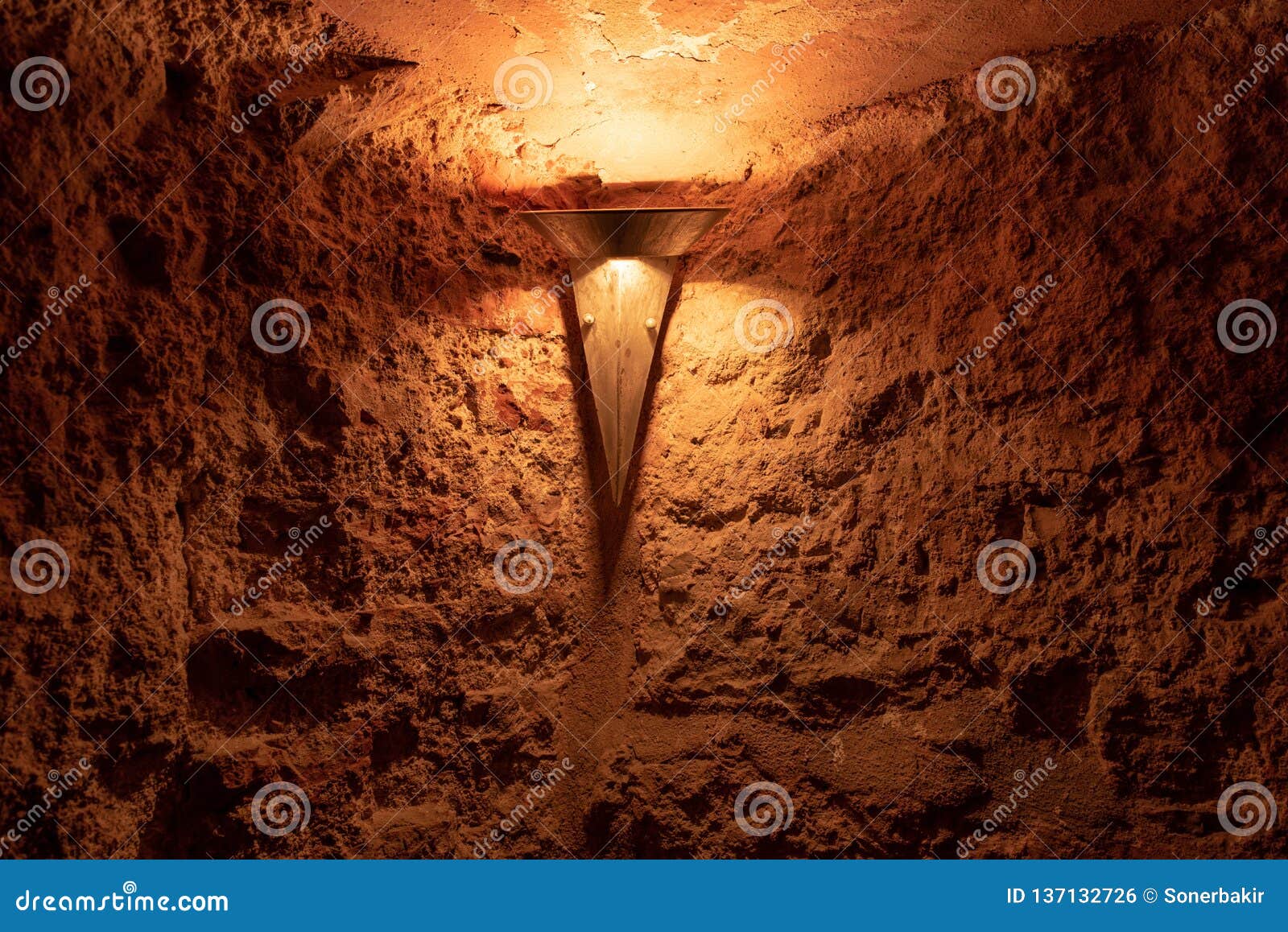 Ancient Rough Wall in Cave with Light from Lamp in Darkness. Stock ...