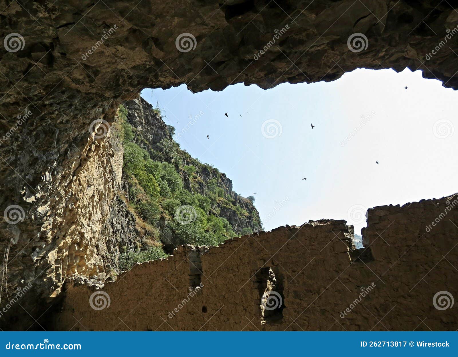 Ancient Ruin Near a Huge Cave Stock Image - Image of grass, tree: 262713817