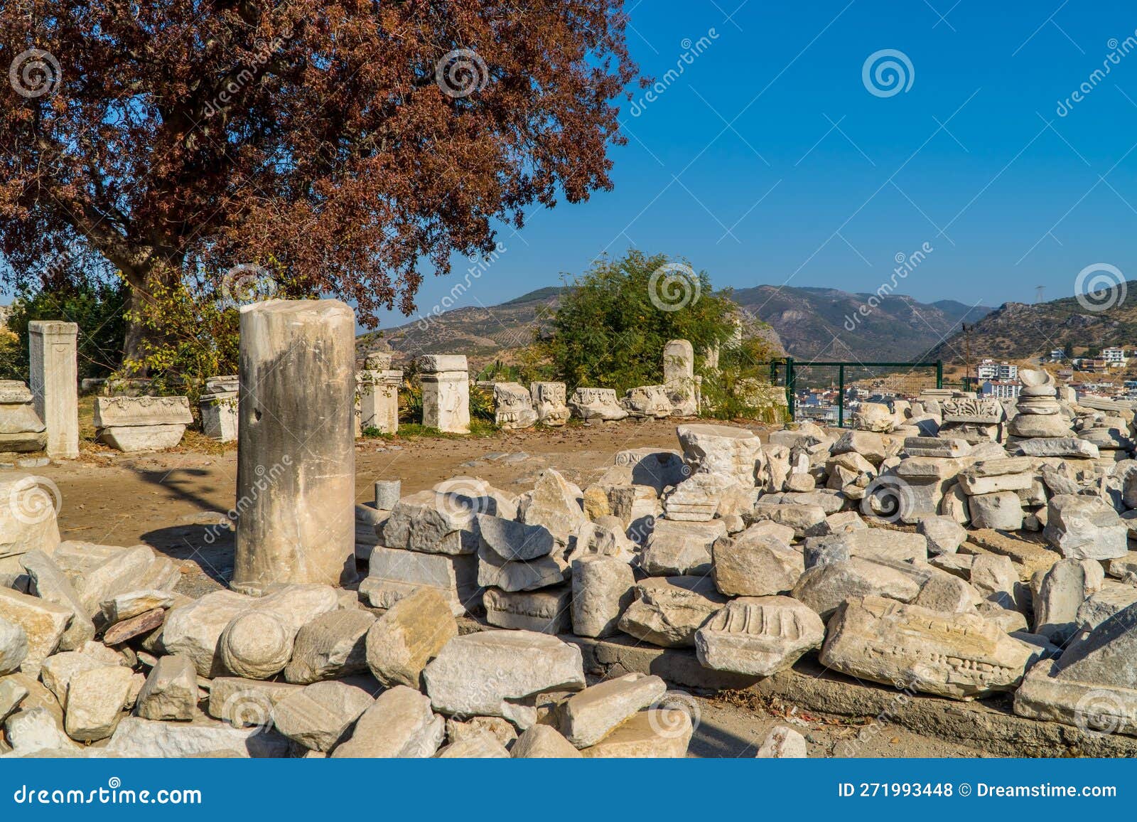 Ruins with a Pile of Large Rocks & Old Town in the Background Stock ...