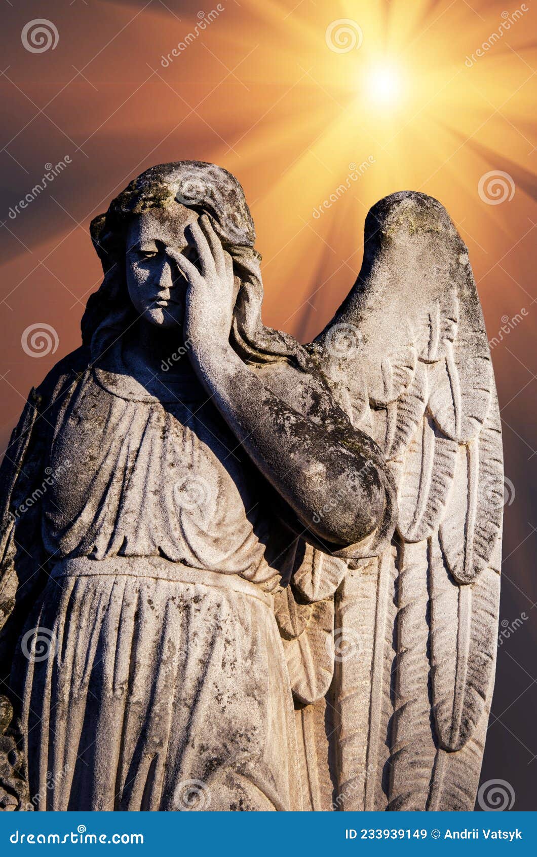 An Ancient Sculpture of a Sad Angel Mourning the Dead, Against the ...