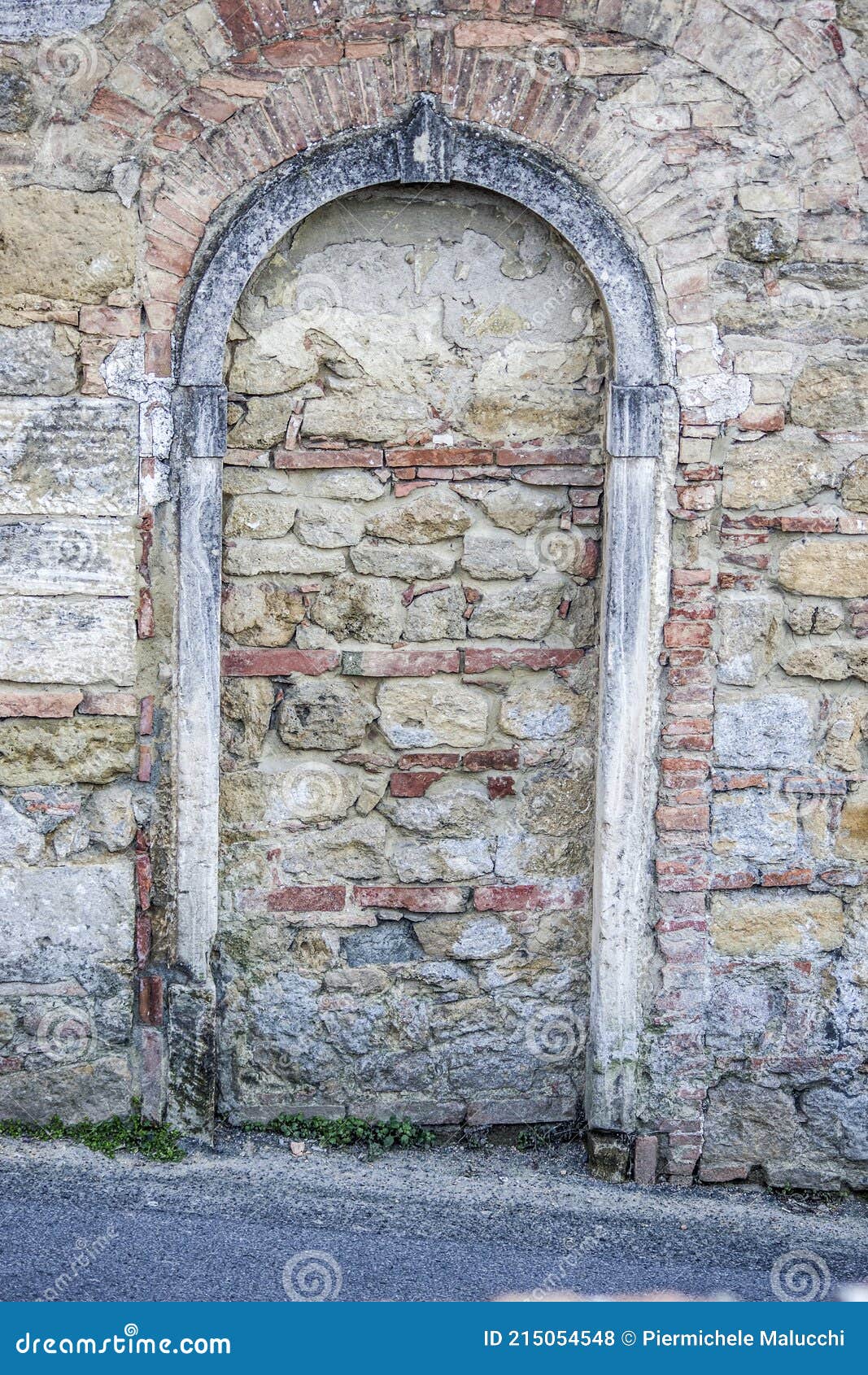 Ancient Stone Arch in the Medieval Walls of the Historic City Stock ...