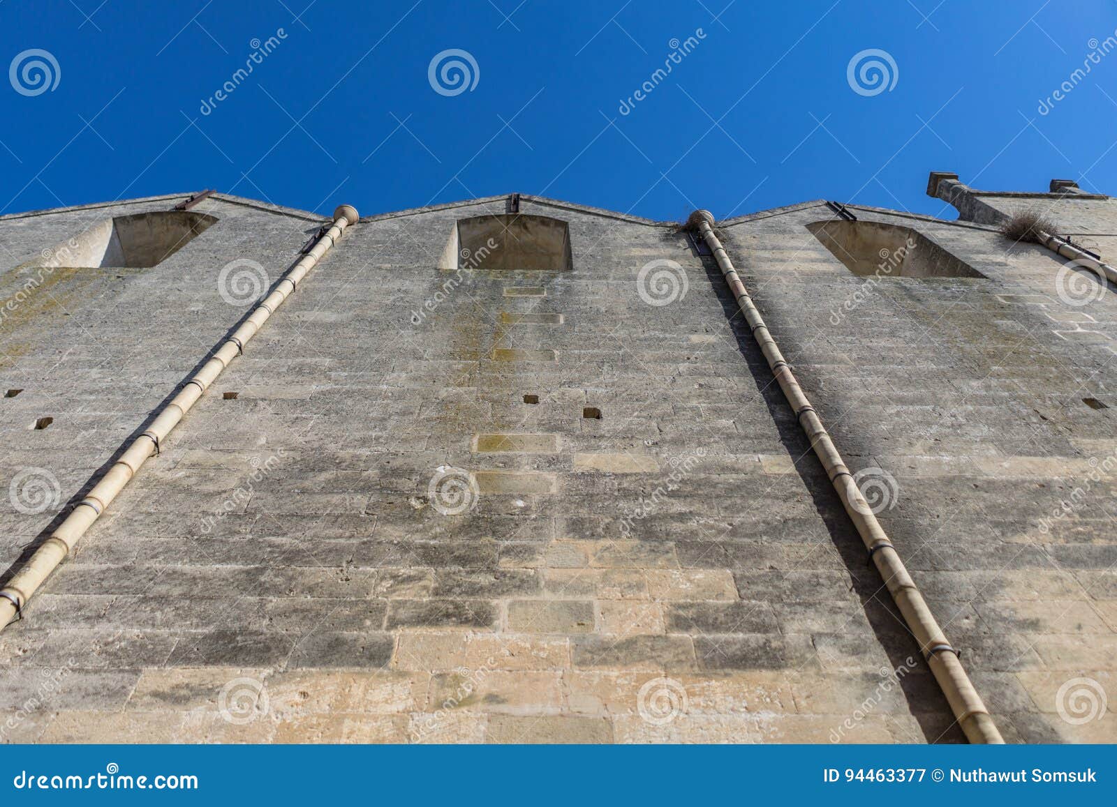 Ancient Stone Brick Wall with Gutter and Clear Blue Sky in the B Stock ...