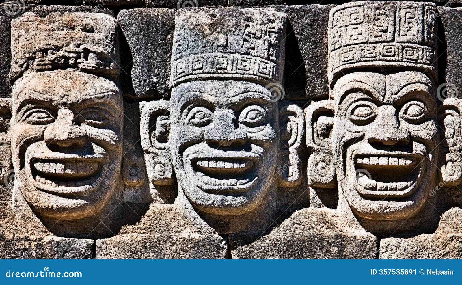 Ancient Stone Carvings of Smiling Faces at Archaeological Site Stock ...