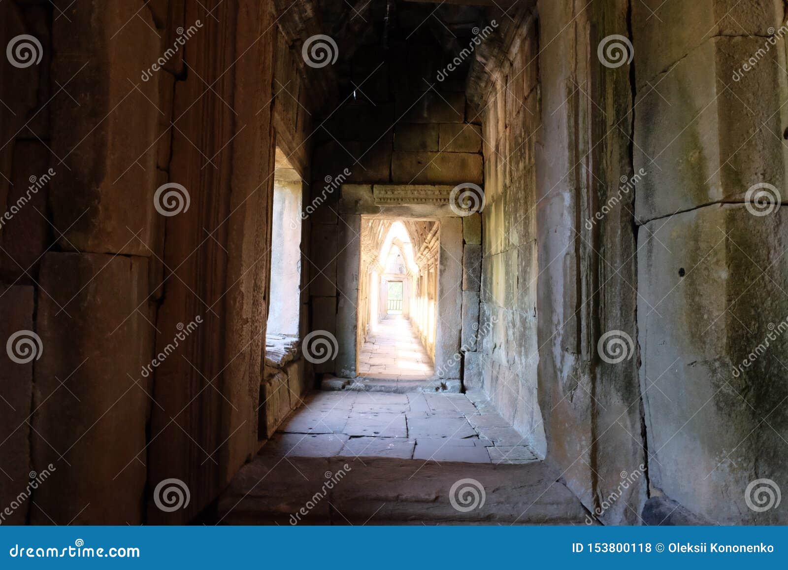 Ancient Stone Corridor Bathed in Sunlight. Stone Vaults Stock Photo ...