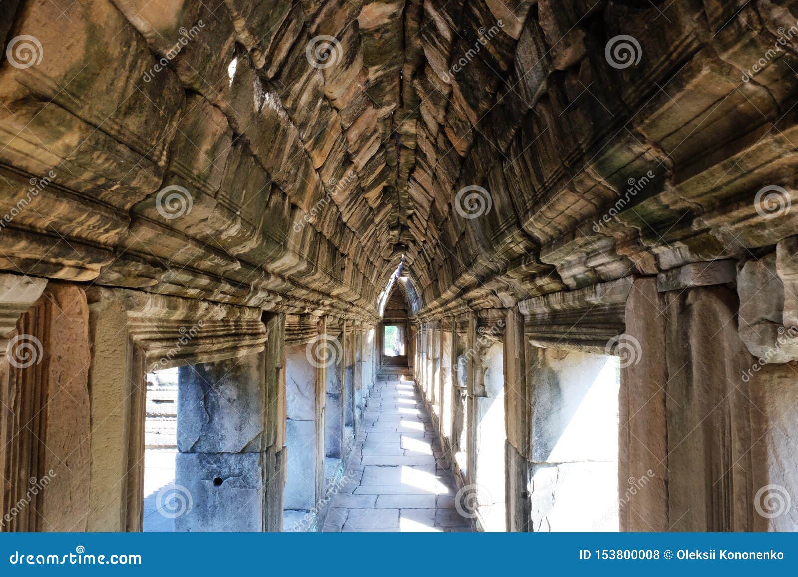 Ancient Stone Corridor Bathed in Sunlight. Stone Vaults Stock Photo ...