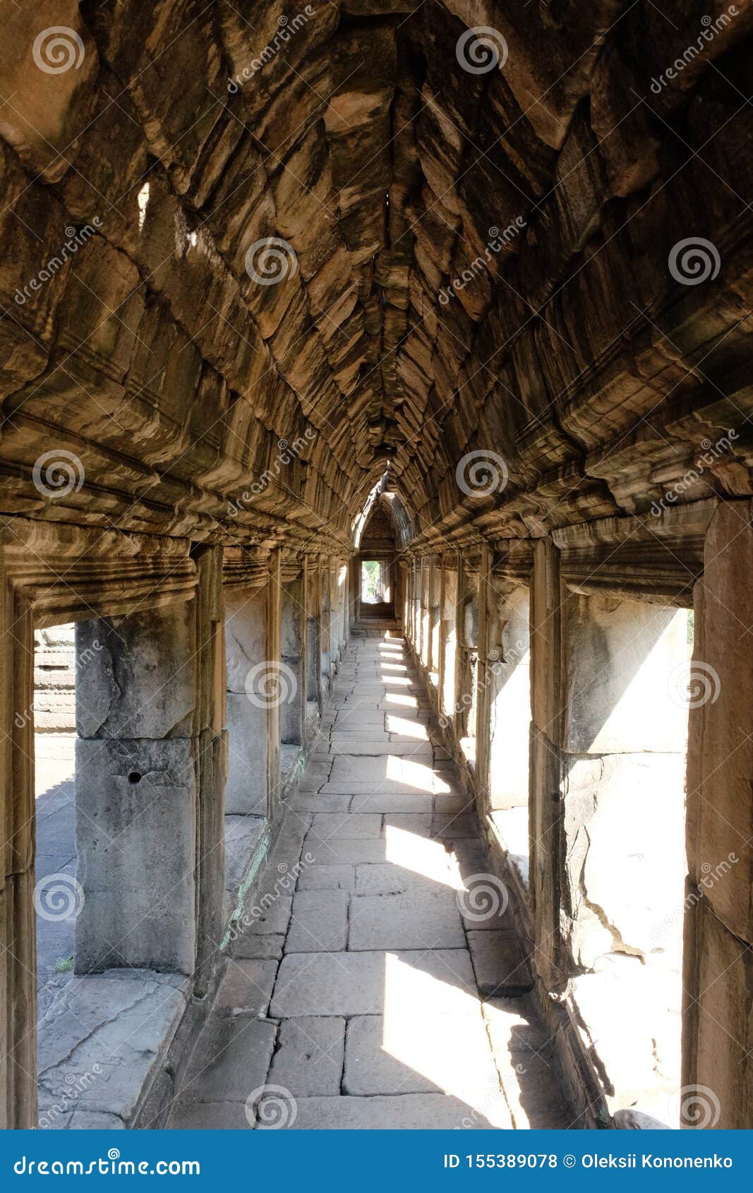 Ancient Stone Corridor Bathed in Sunlight. Stone Vaults Stock Photo ...