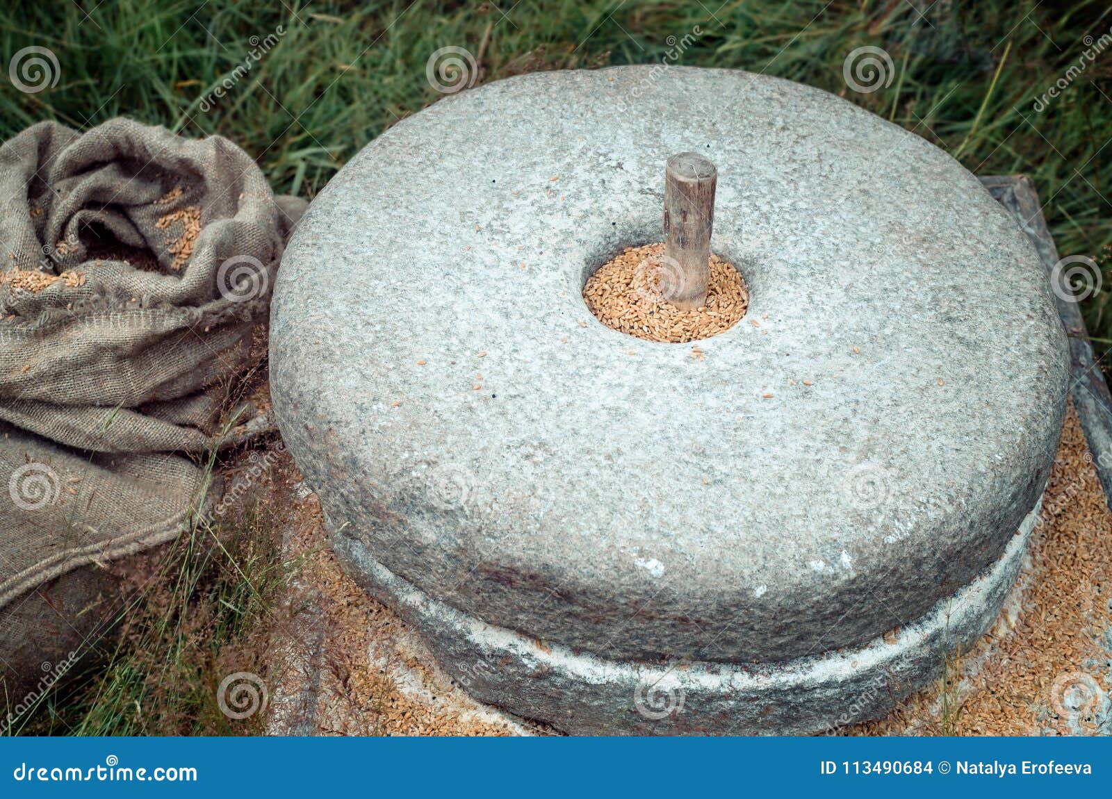 The Ancient Stone Hand Mill with Grain Stock Photo - Image of antique ...