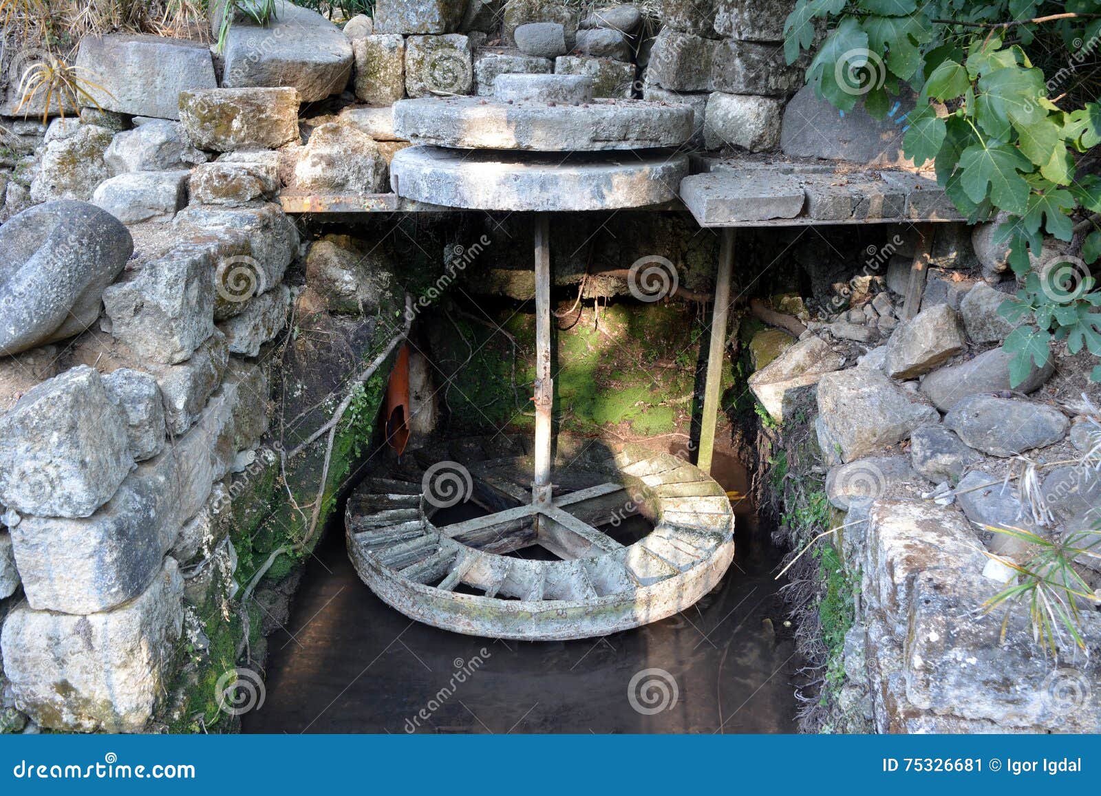 Ancient stone mill wheel. stock image. Image of vintage - 75326681