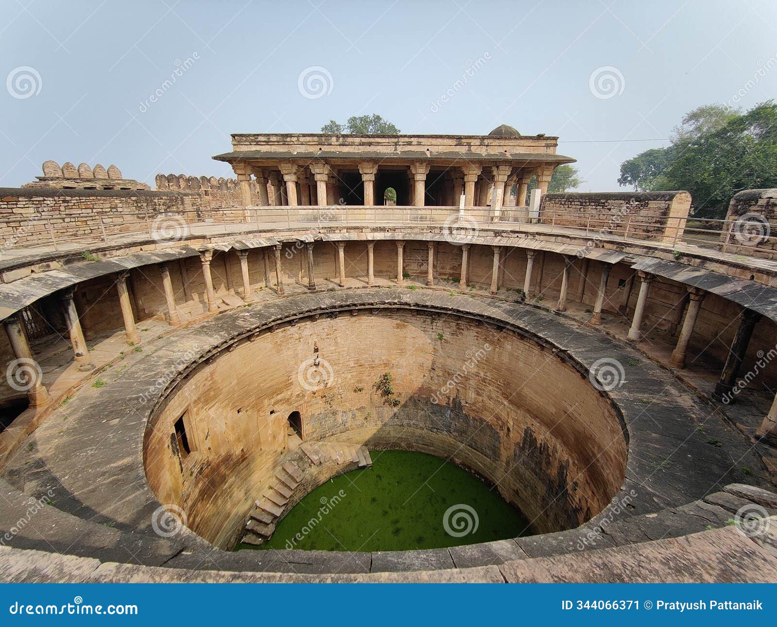Ancient Stone Pavilion with Colonnade Overlooking Circular Stepwell in ...