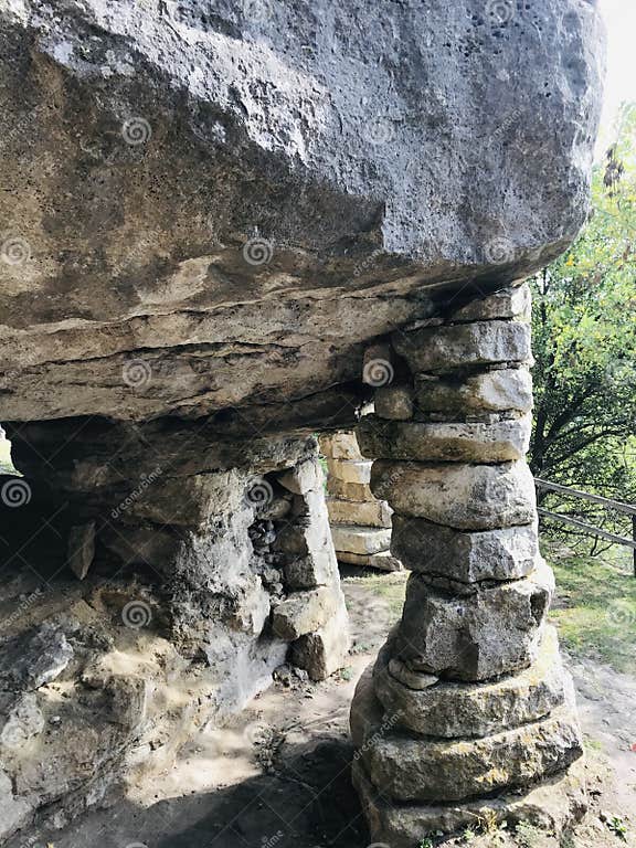 Ancient Stone Structure Surrounded by Lush Greenery and Sunlight Stock ...