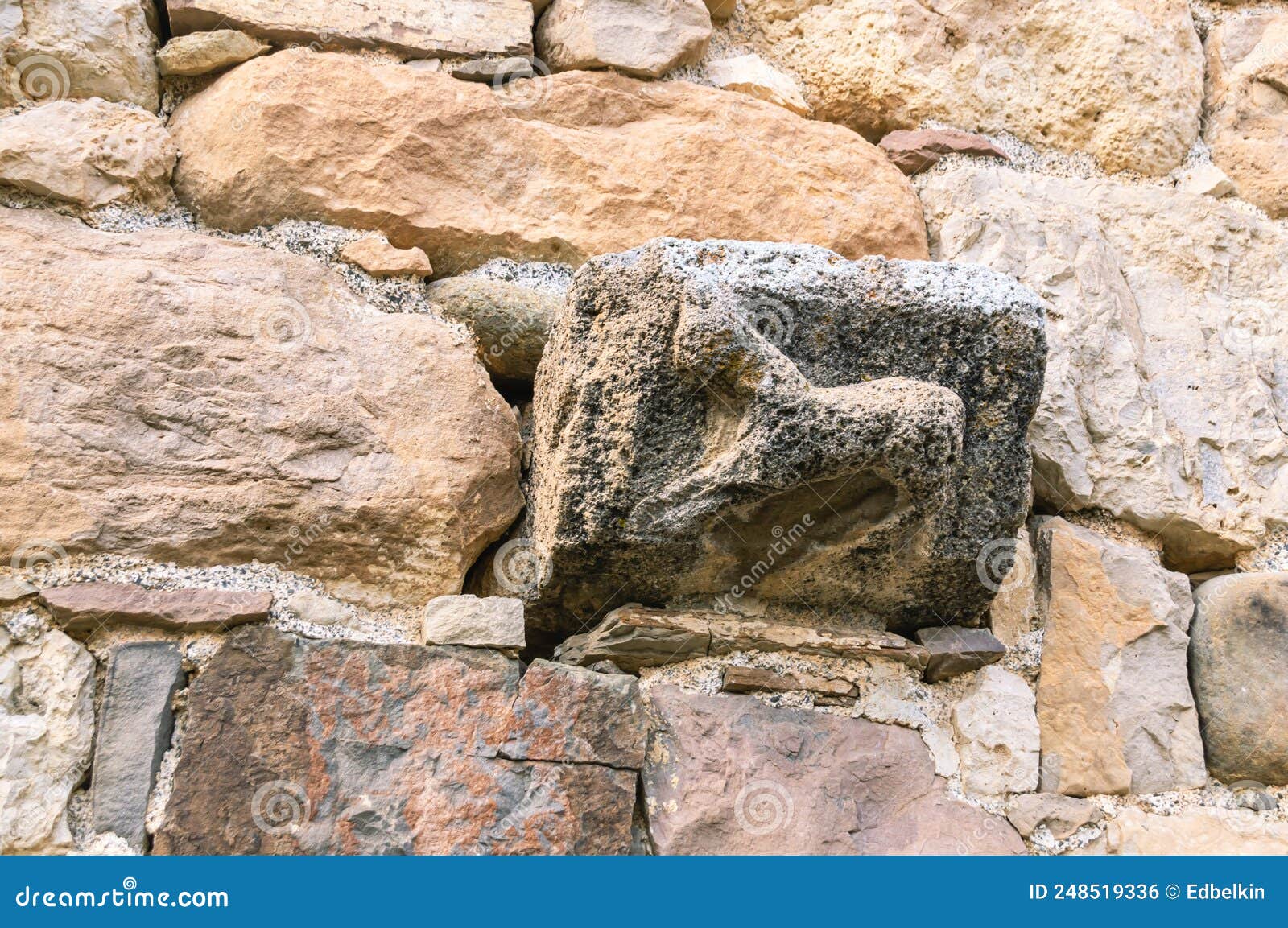 An Ancient Stone Wall with Images that Have Undergone Devastating Erosion Stock Photo - Image of ...