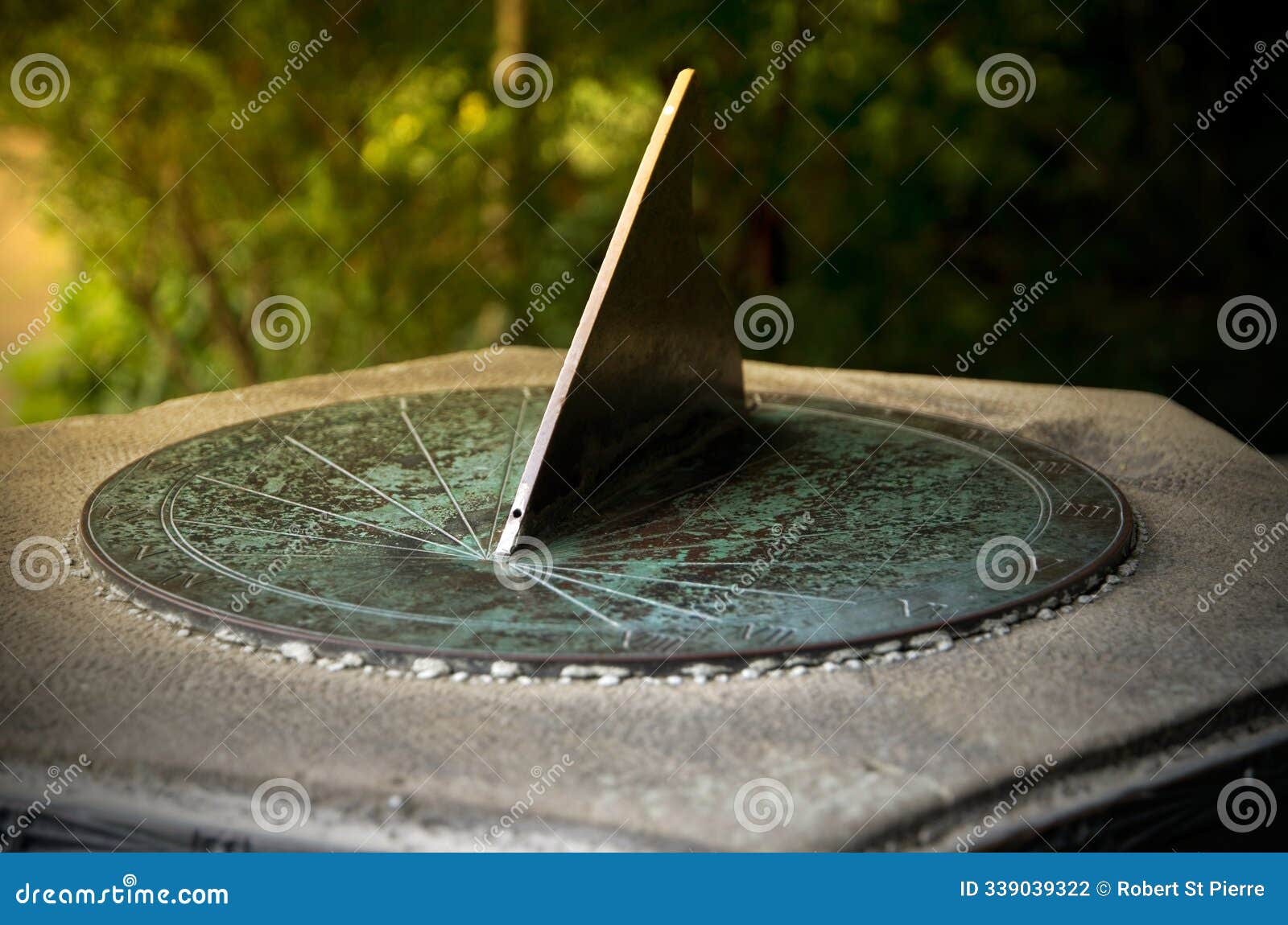 Ancient Sundial Clock with Blurred Flowers in Background Stock Photo ...