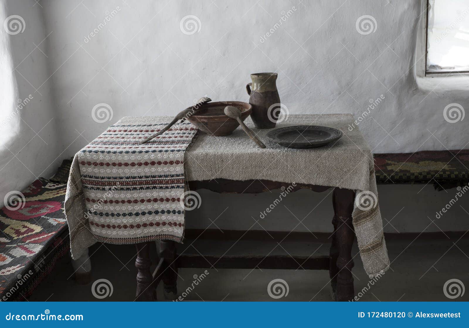 Ancient table with dishes stock photo. Image of home - 172480120