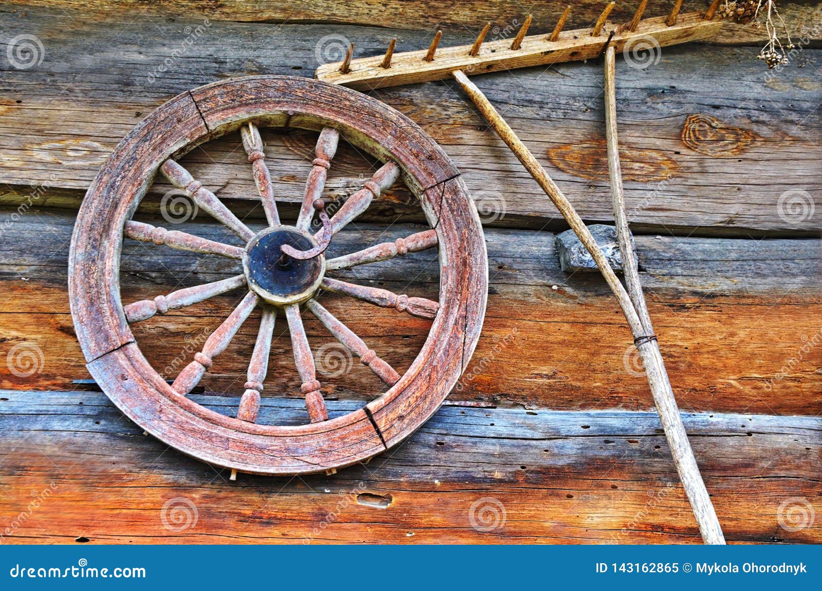 Ancient Wheel and Rake from a Tree Stock Image - Image of spoke ...